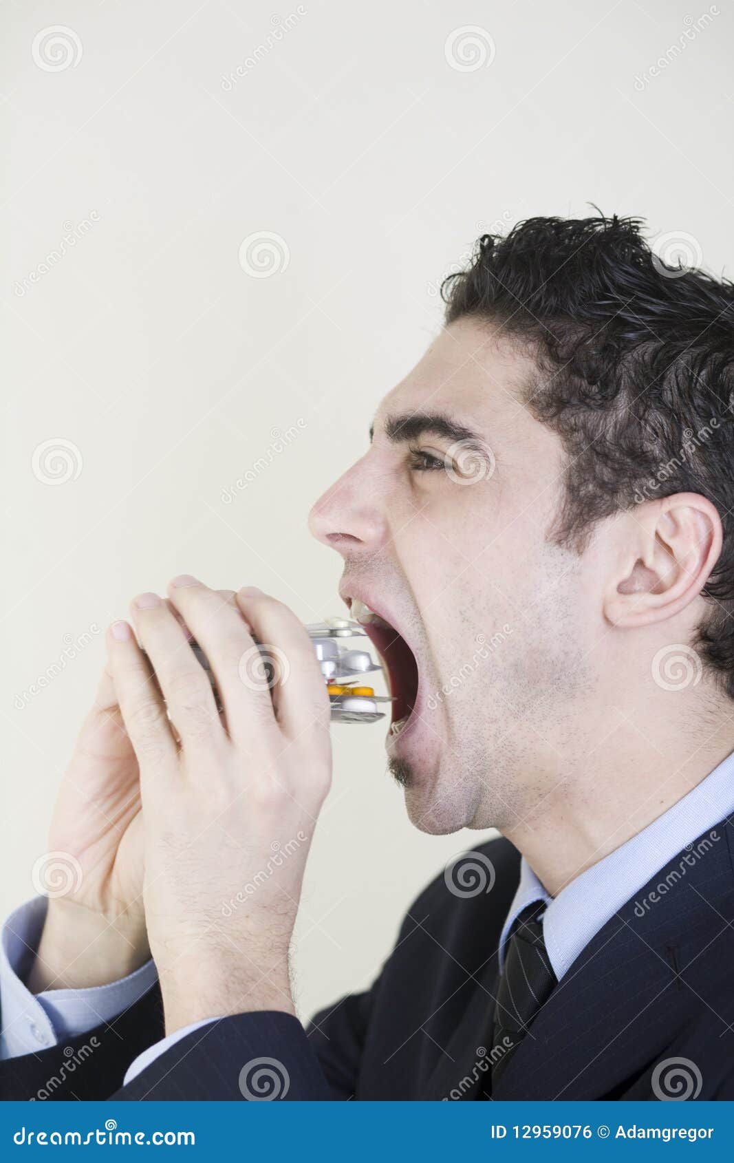 Businessman eating pills stock photo. Image of lips, head - 12959076