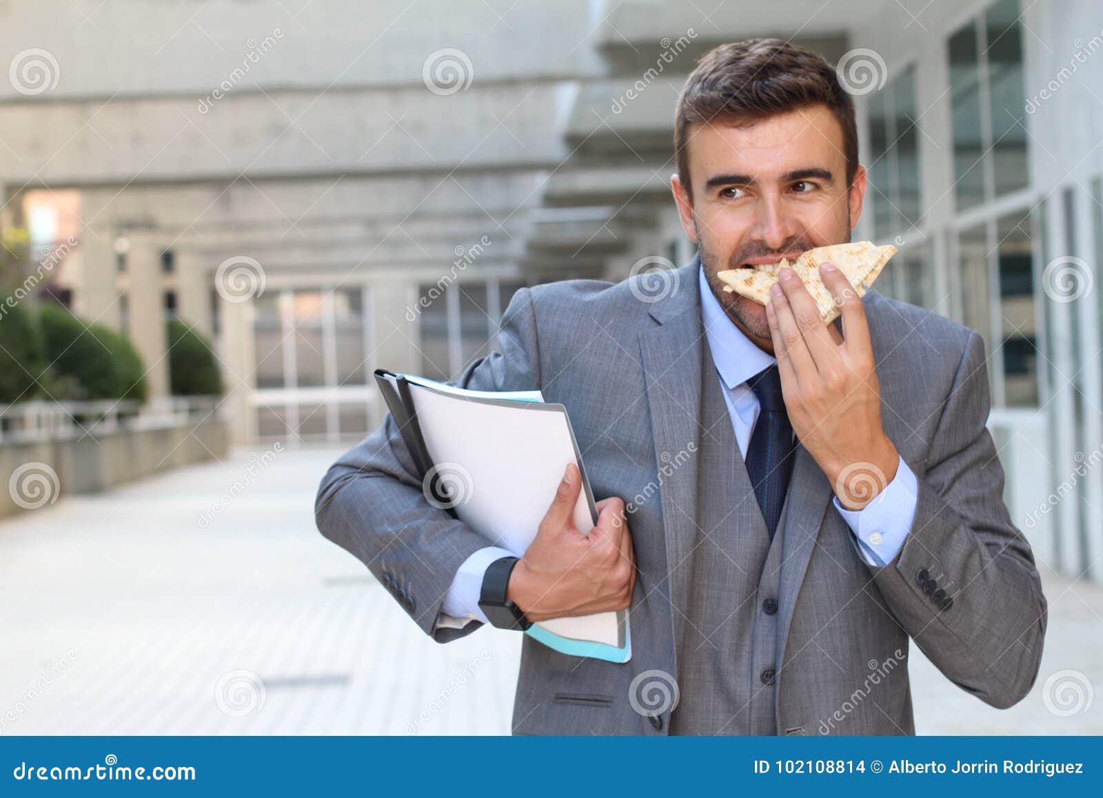 Businessman Eating a Sandwich on the Go Stock Photo - Image of ...
