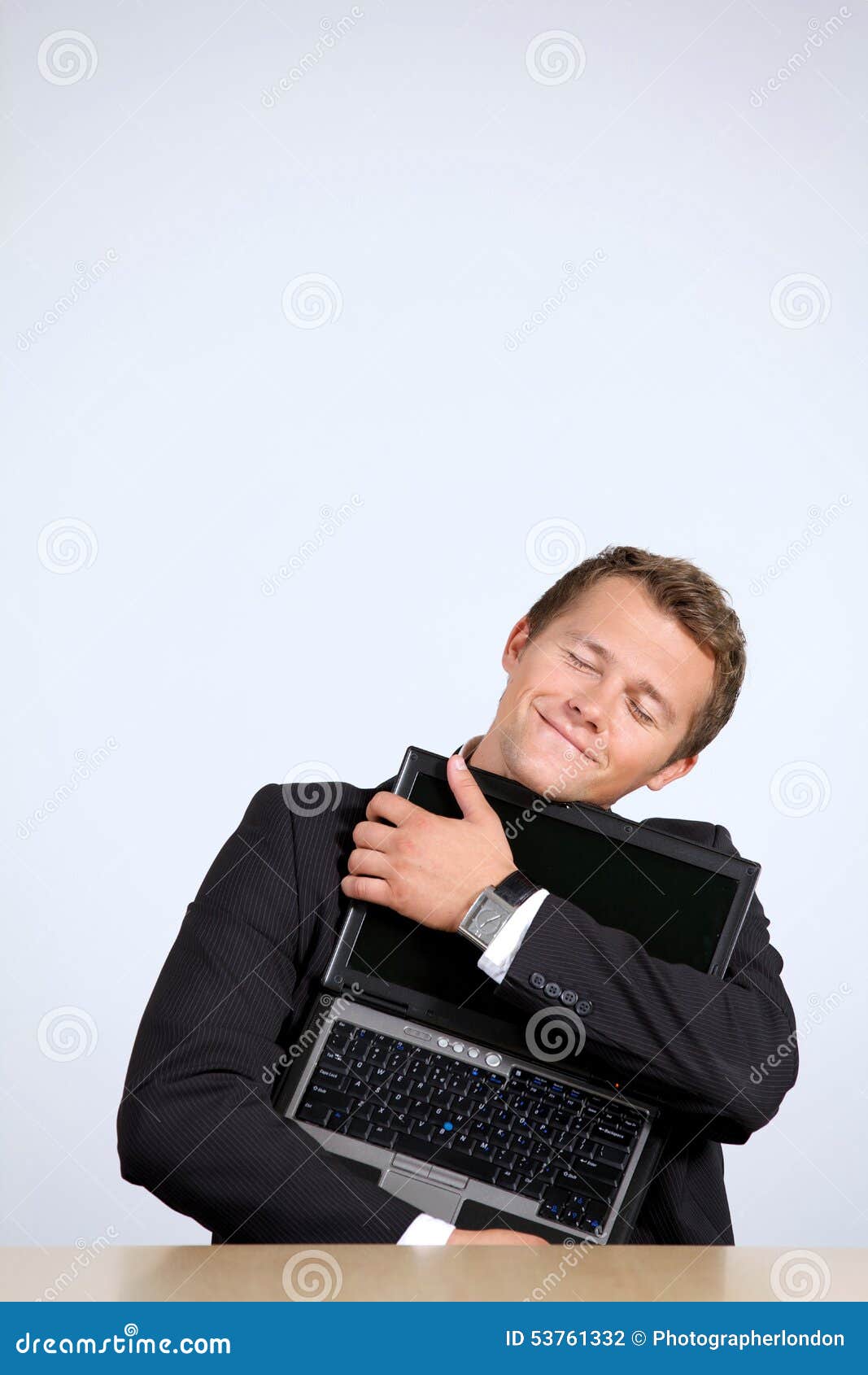 Businessman Embracing Laptop, Eyes Closed Stock Photo - Image of ...