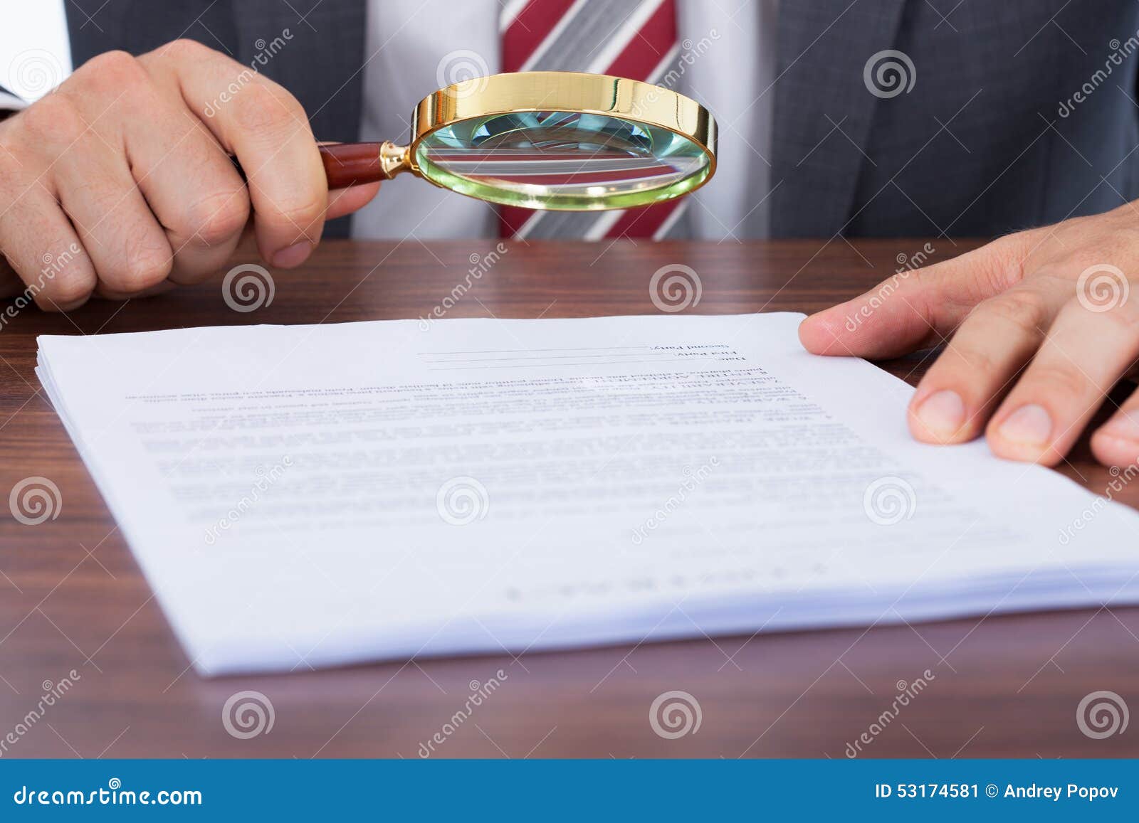 Businessman Examining Document with Magnifying Glass Stock Image ...