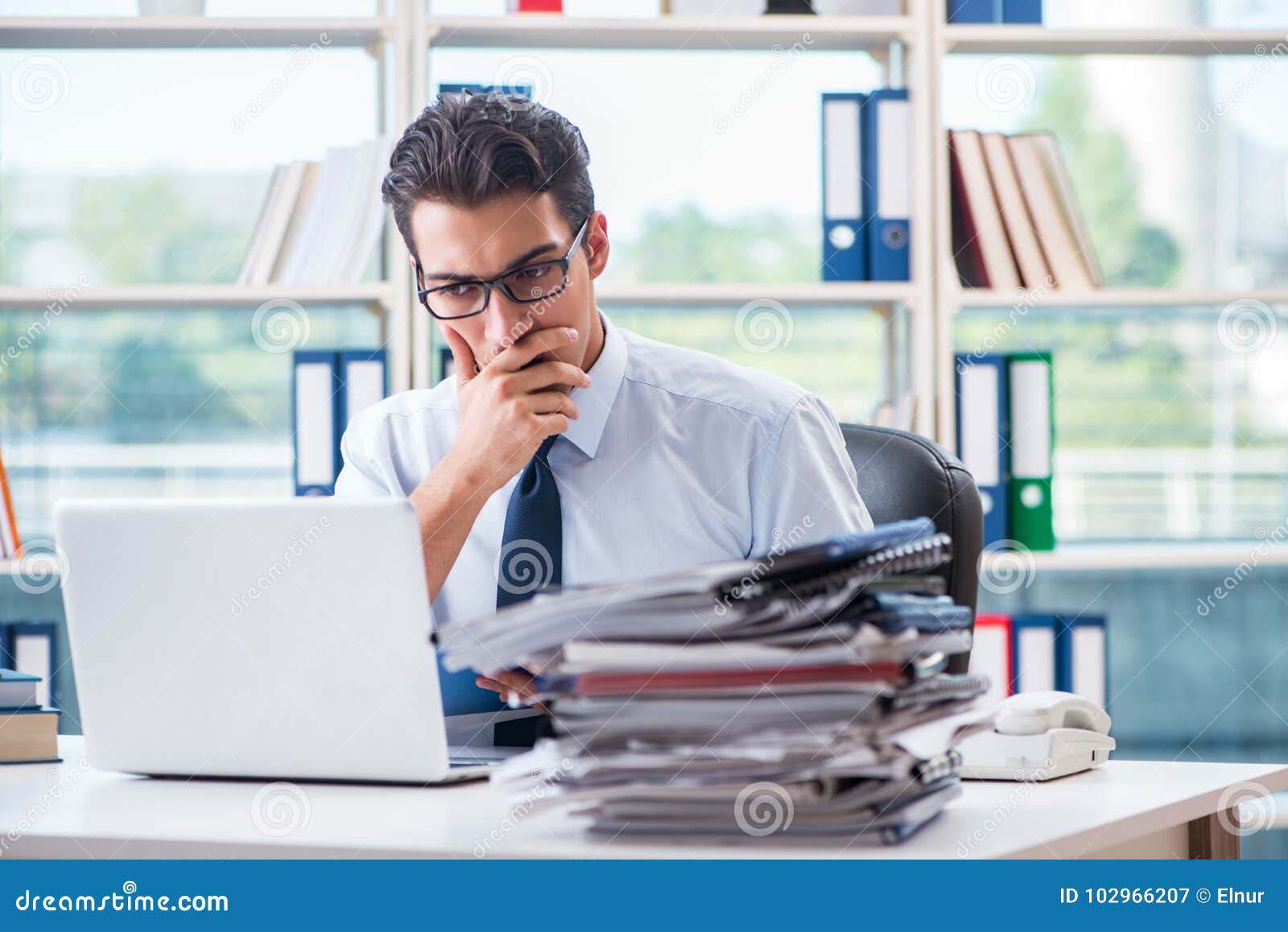 The Businessman with Excessive Work Paperwork Working in Office Stock ...