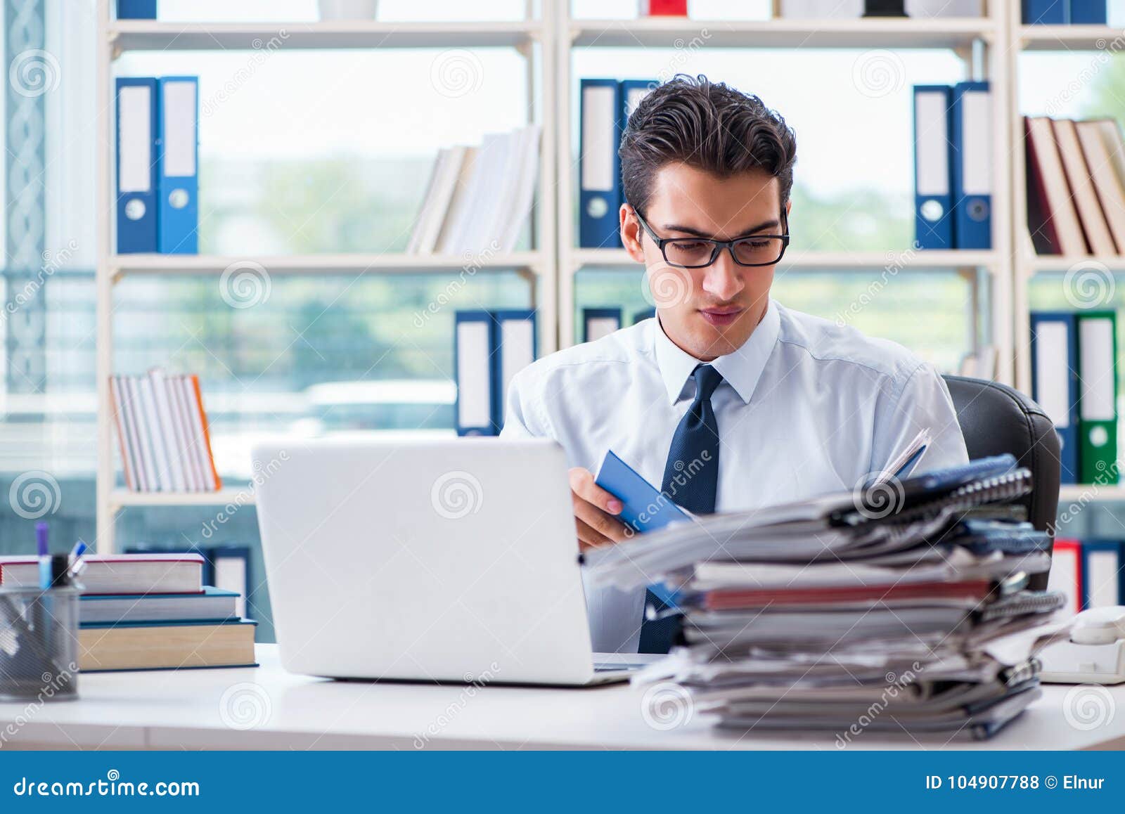 The Businessman with Excessive Work Paperwork Working in Office Stock ...
