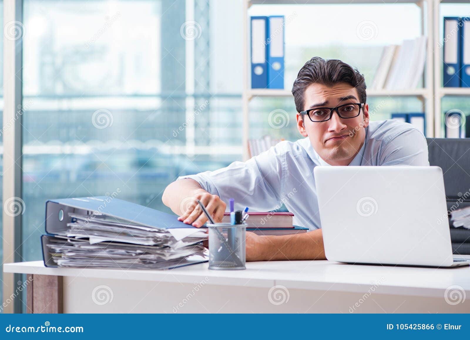 The Businessman with Excessive Work Paperwork Working in Office Stock ...