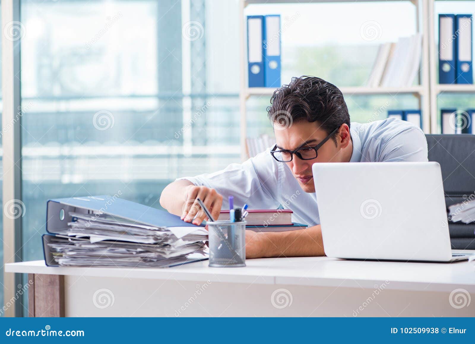 The Businessman with Excessive Work Paperwork Working in Office Stock ...