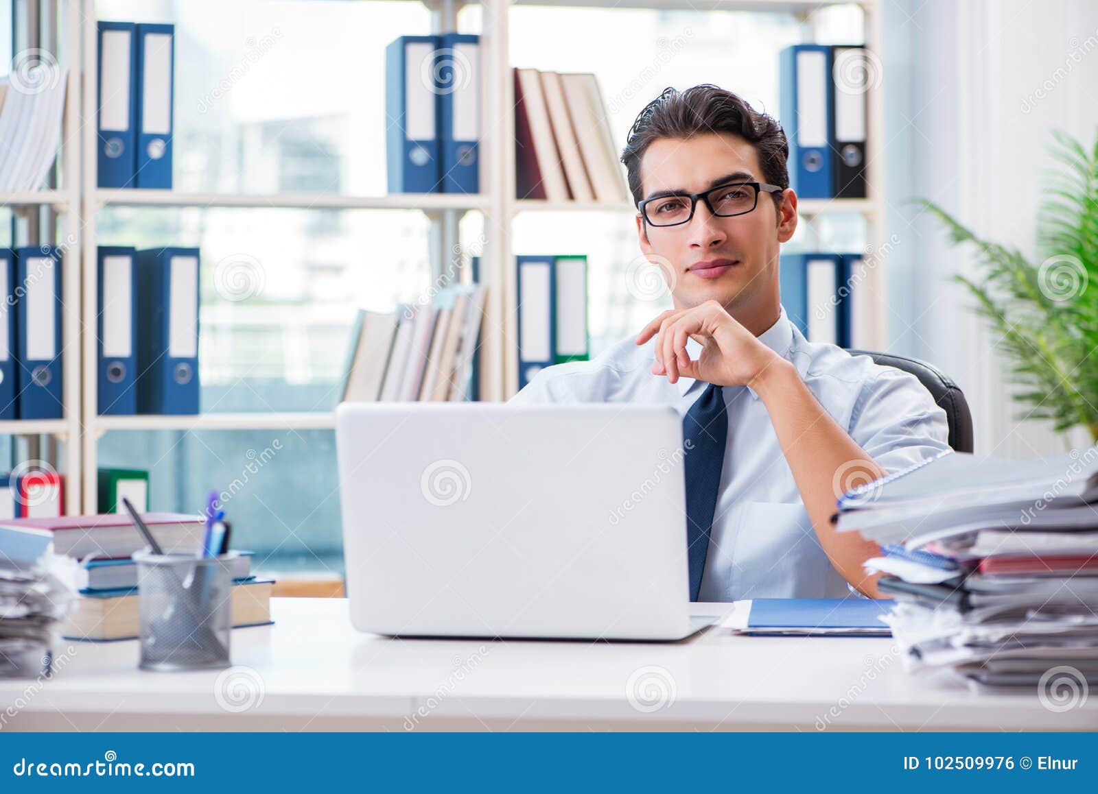 The Businessman with Excessive Work Paperwork Working in Office Stock ...