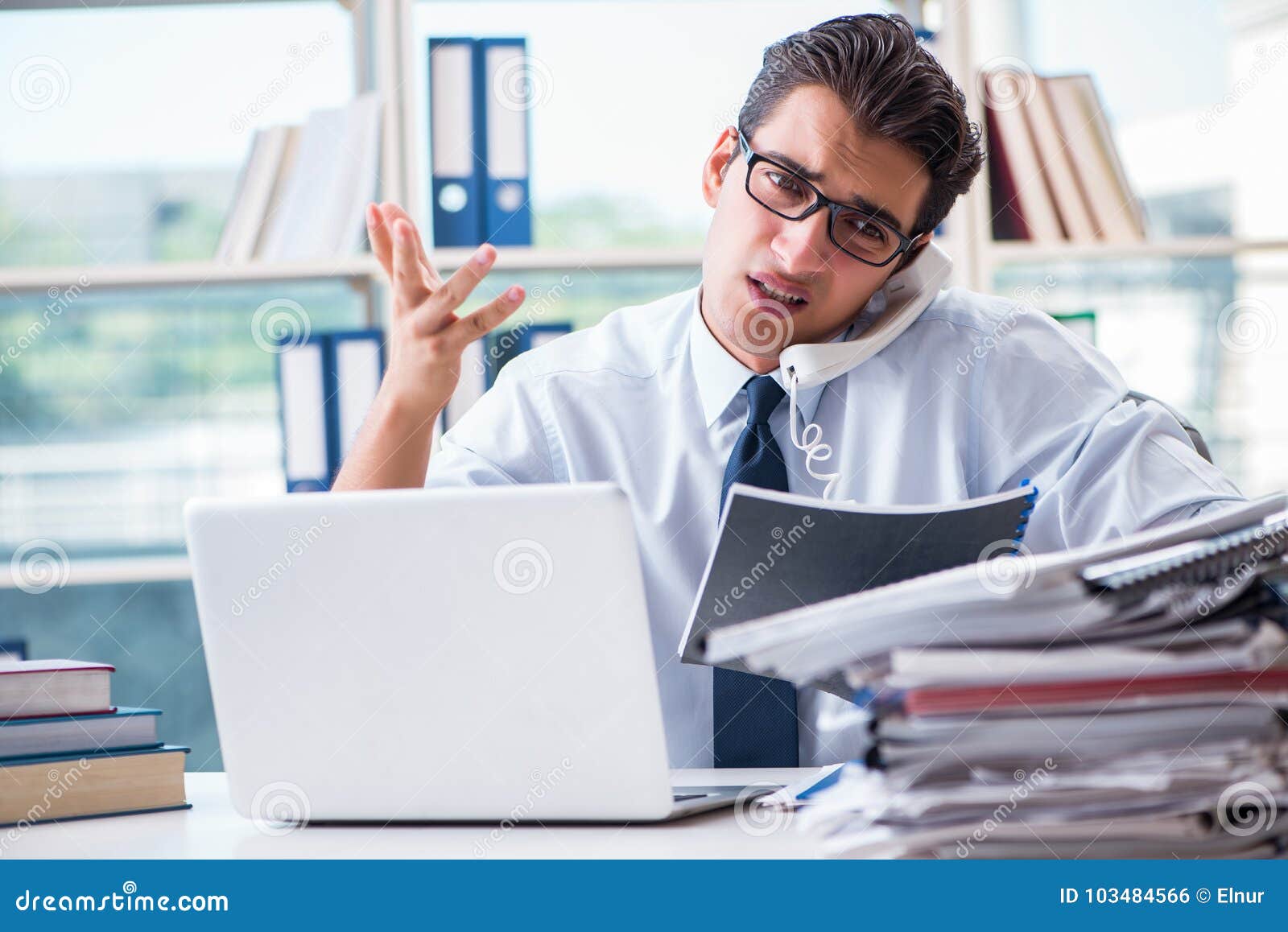 The Businessman with Excessive Work Paperwork Working in Office Stock ...