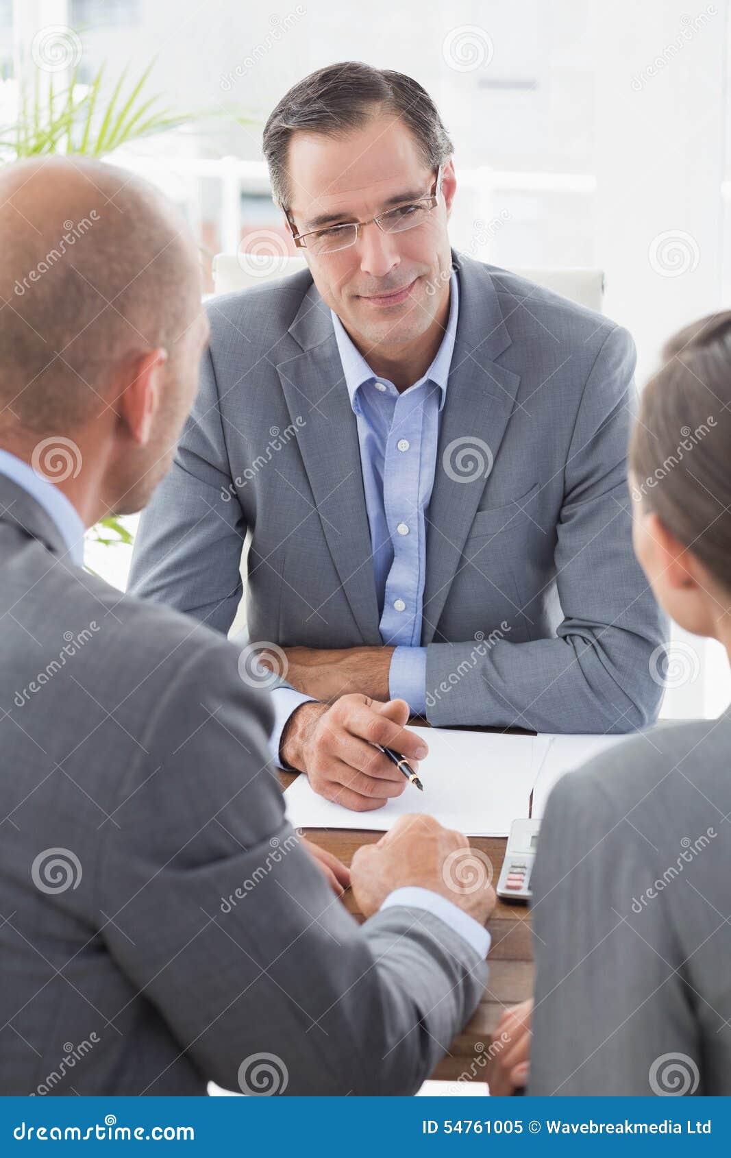 Businessman Explaining Contract To Business Partners Stock Image ...
