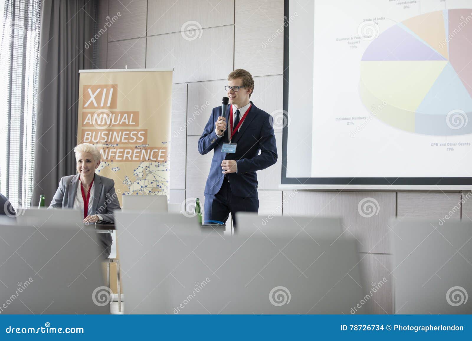 Businessman Explaining Pie Chart in Seminar Hall Stock Photo - Image of ...