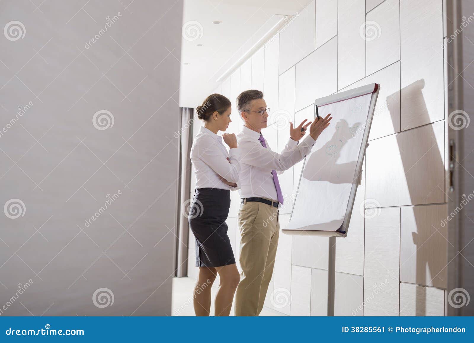 Businessman Explaining Strategy To Coworker in Office Stock Image ...