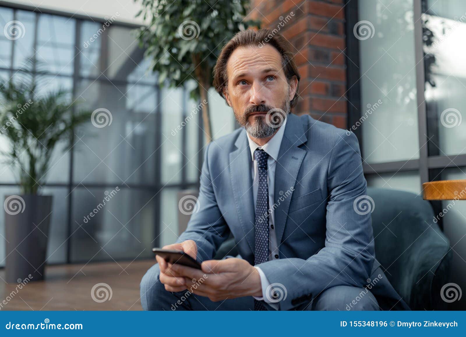 Businessman Feeling Thoughtful while Waiting for the Meeting Stock ... Businessman Feeling Thoughtful while Waiting for the Meeting Stock ...