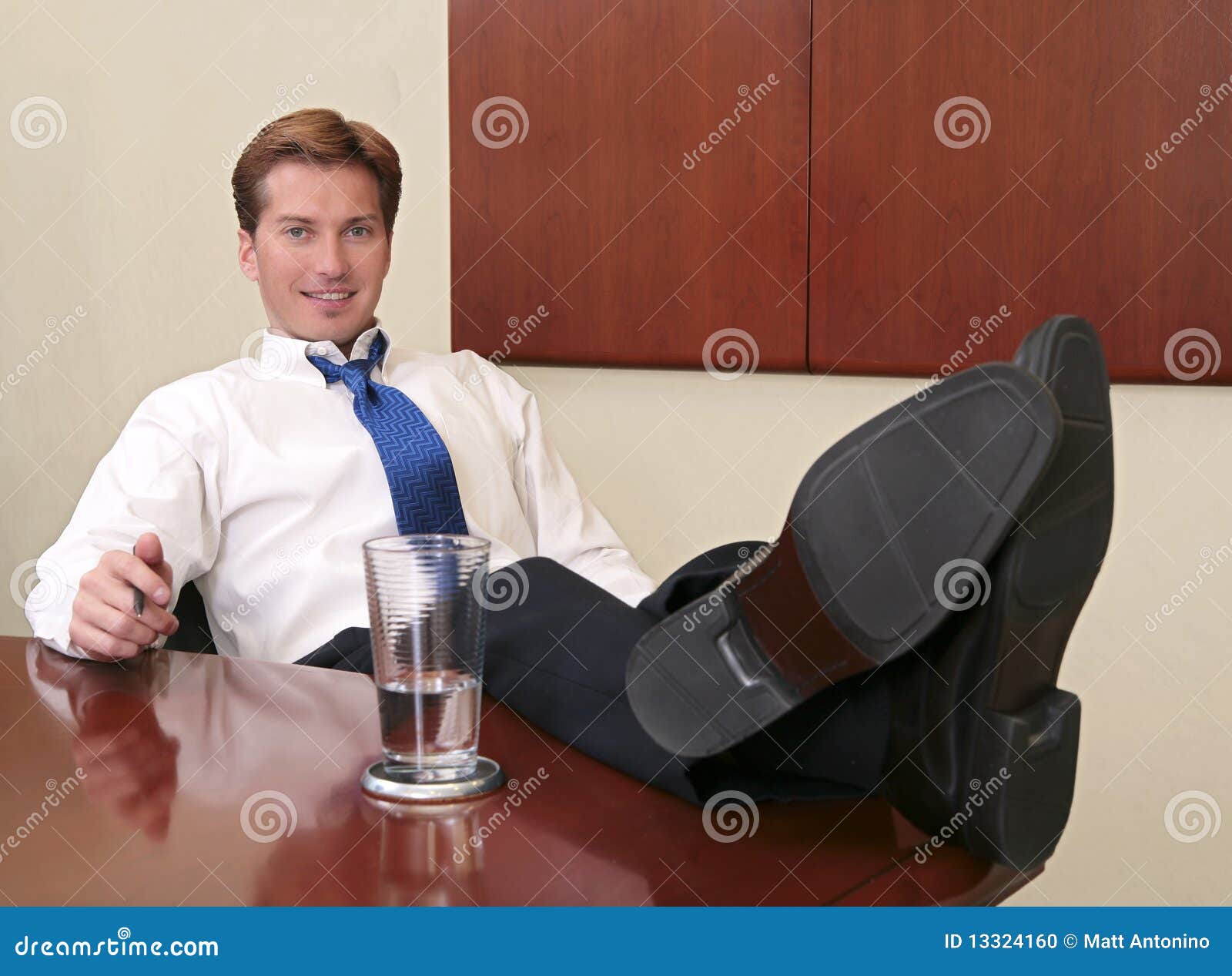 Businessman with feet up stock photo. Image of manager - 13324160