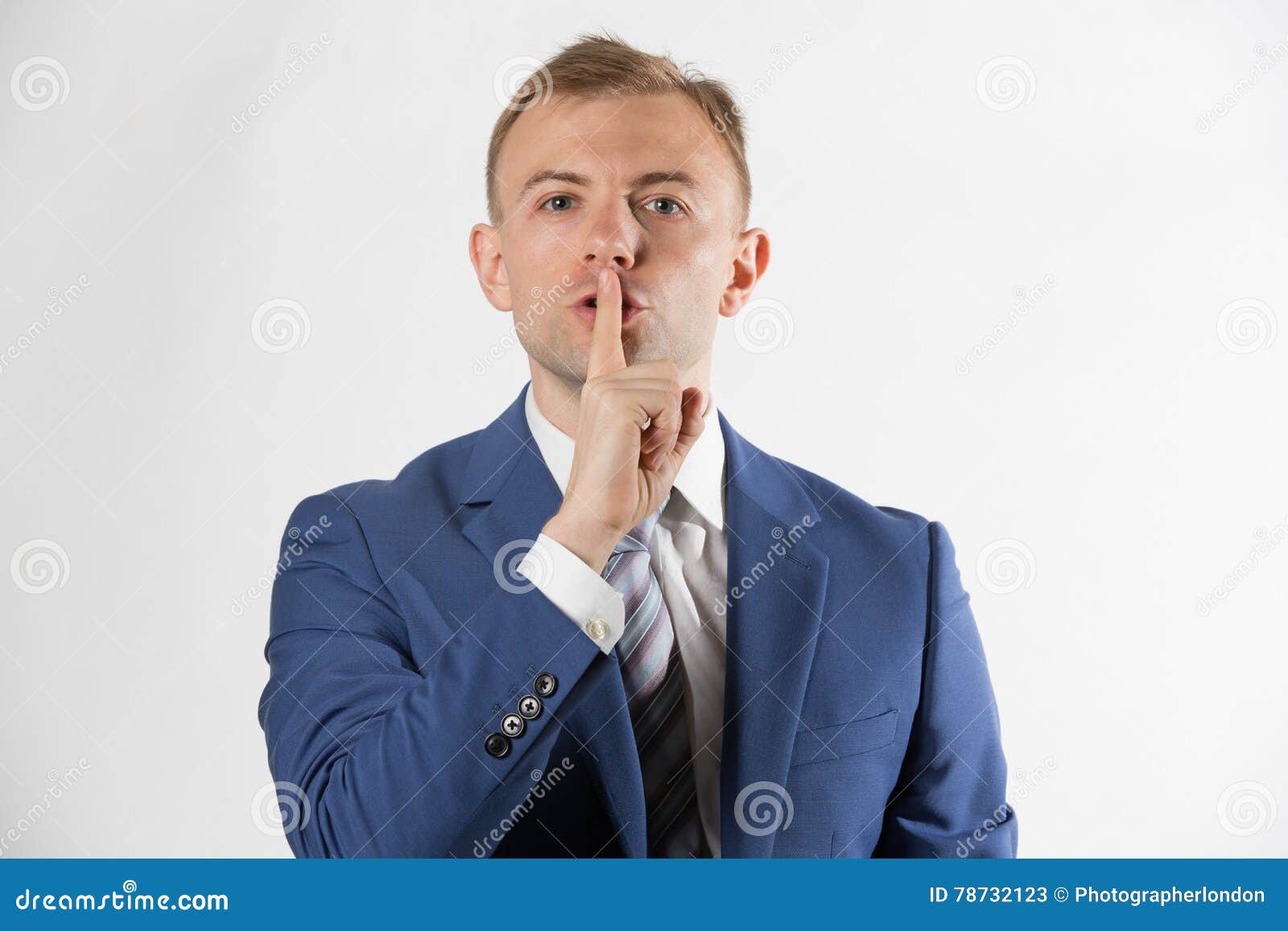 Businessman with Finger Over Lips Stock Image - Image of face, finger ...