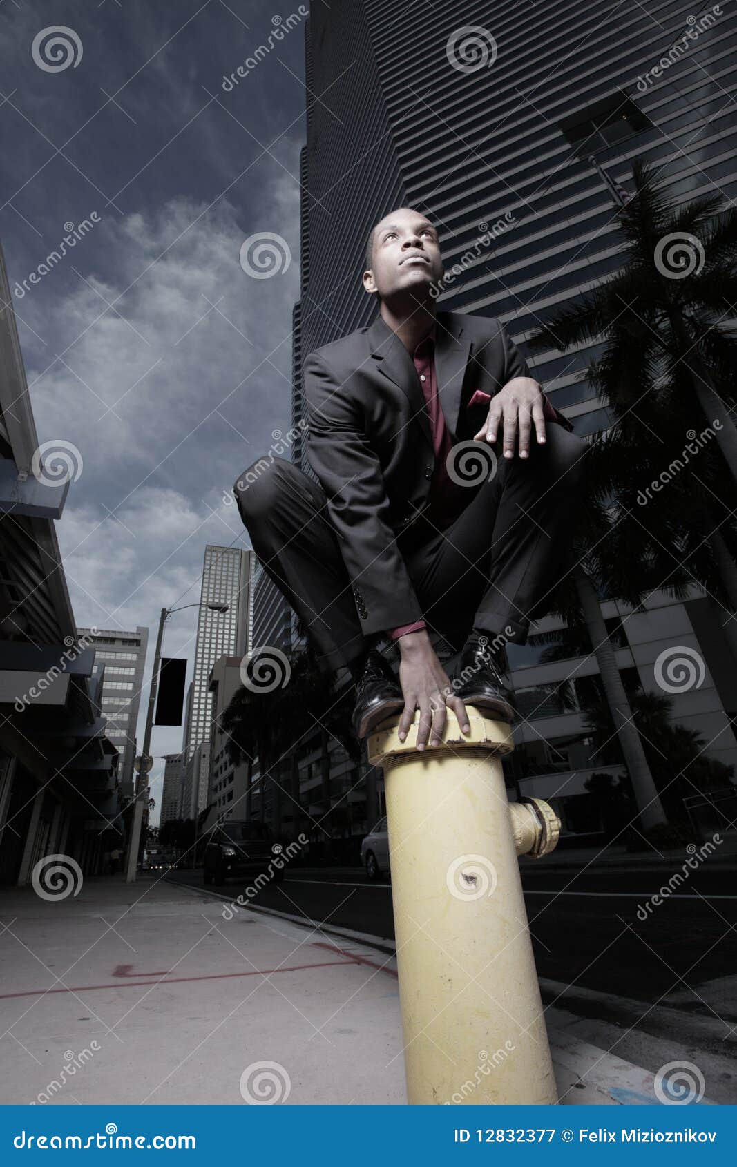 Businessman on a Fire Hydrant Stock Image - Image of night, african ...