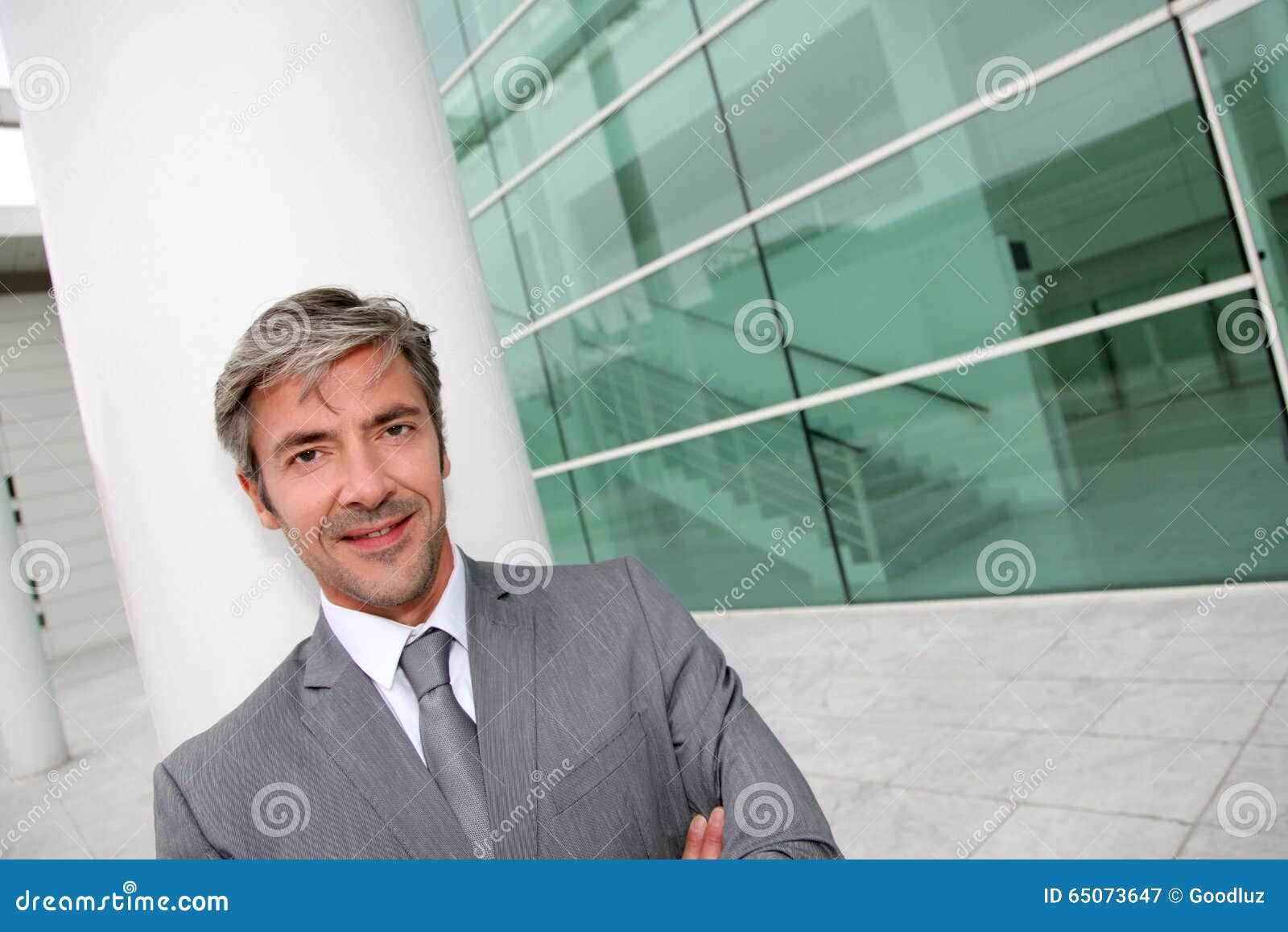 Businessman in Front of Modern Building Stock Image - Image of ...