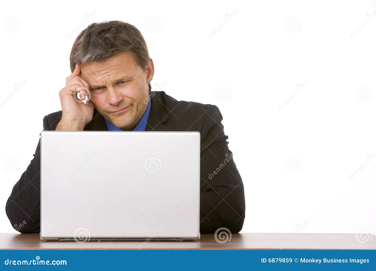 Businessman Frowning while Looking at Laptop Stock Image - Image of ...