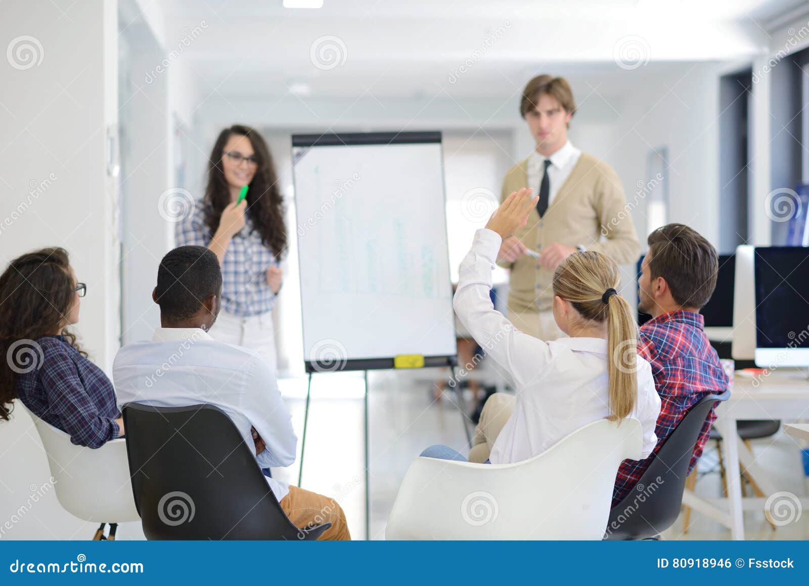 Businessman Giving a Presentation To His Colleagues at Work Standing in ...