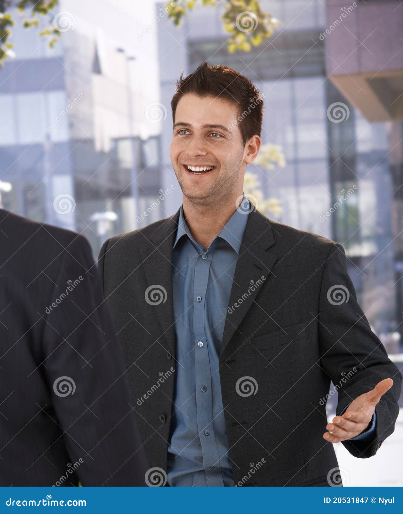 Businessman Greeting Colleague at Office Stock Image - Image of male ...