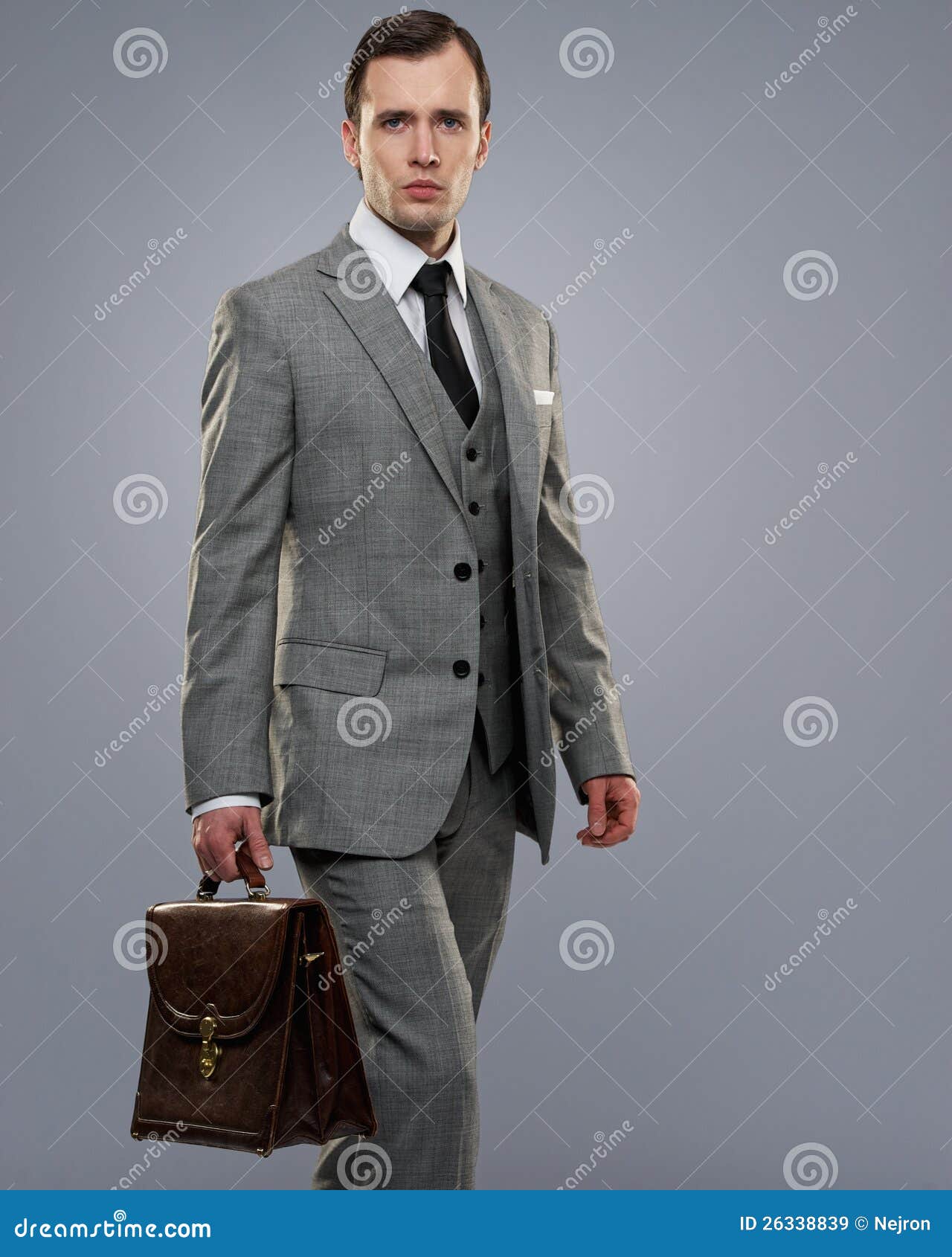 Businessman on grey stock image. Image of retro, brunette - 26338839