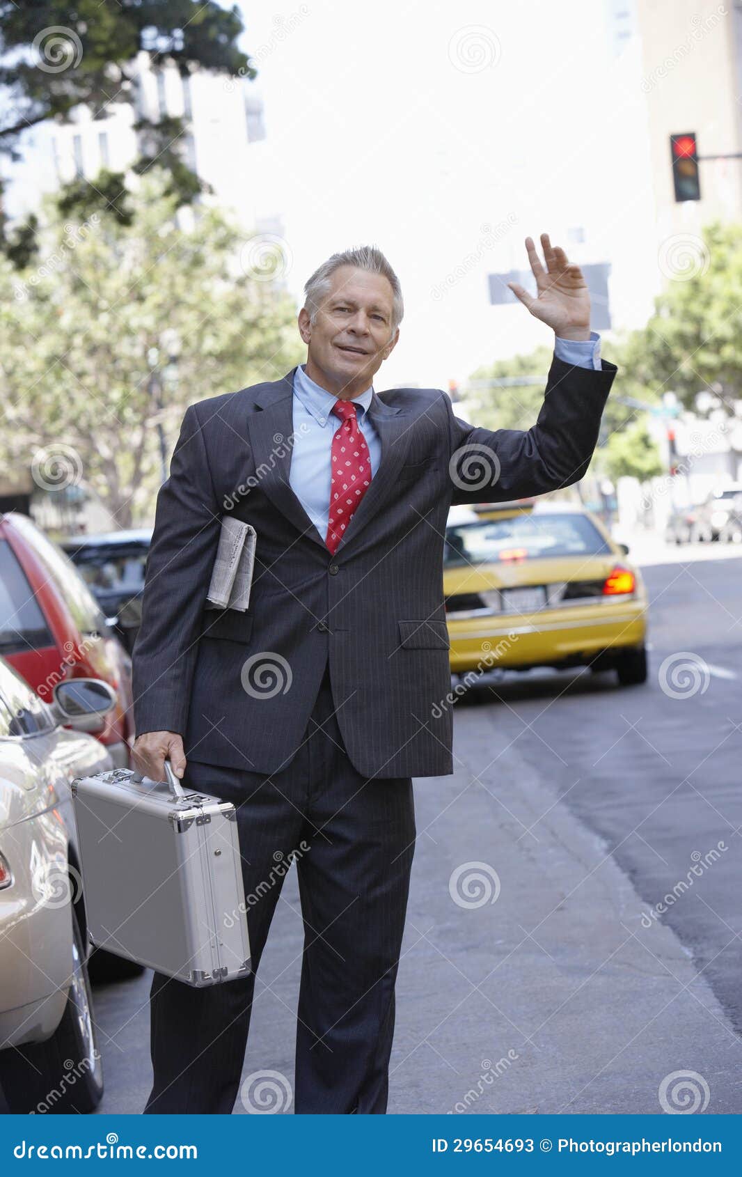 Businessman Hailing a Cab stock image. Image of holding - 29654693