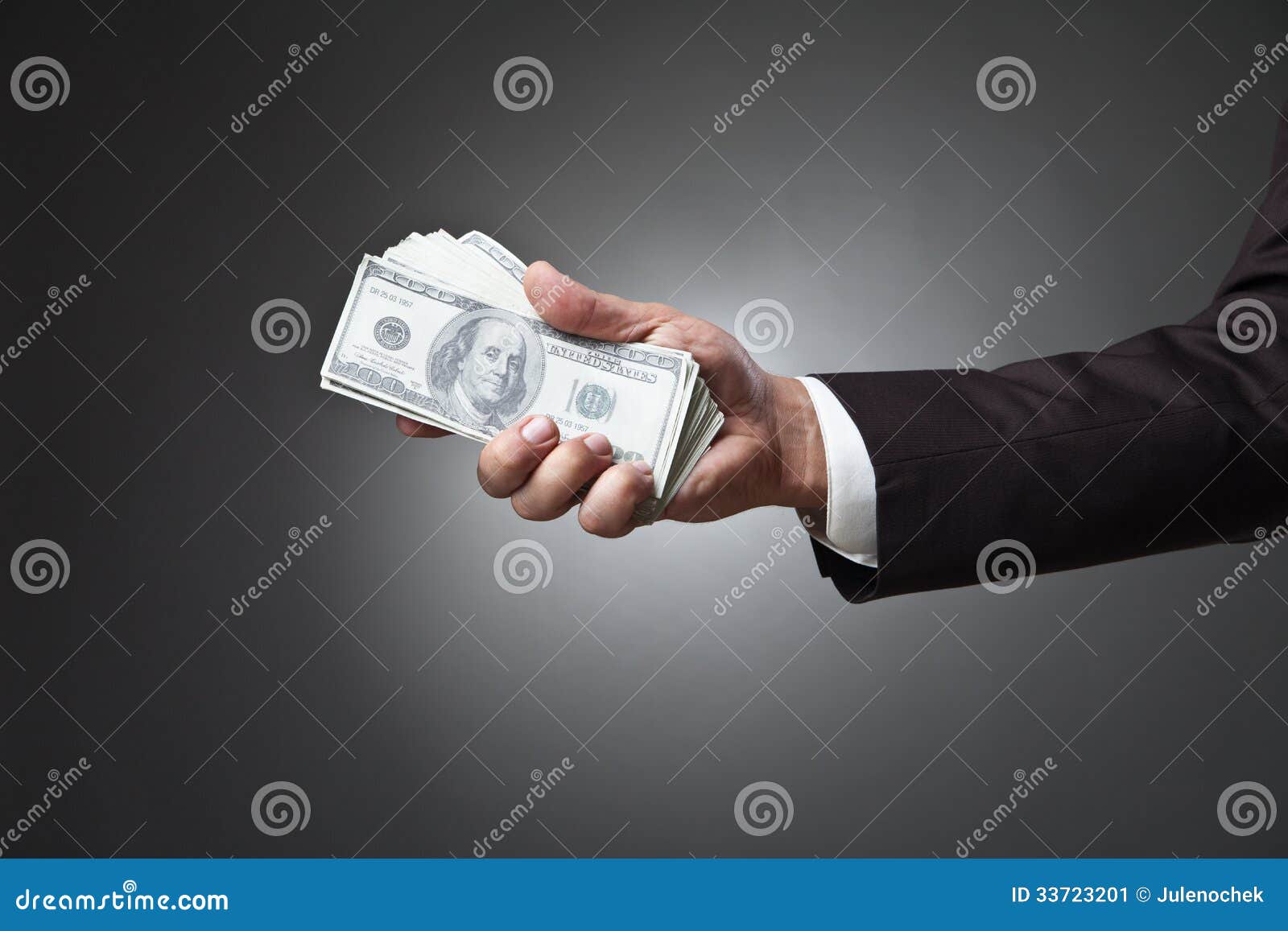 Businessman Hand Holding Money on Dark Background Stock Image - Image ...