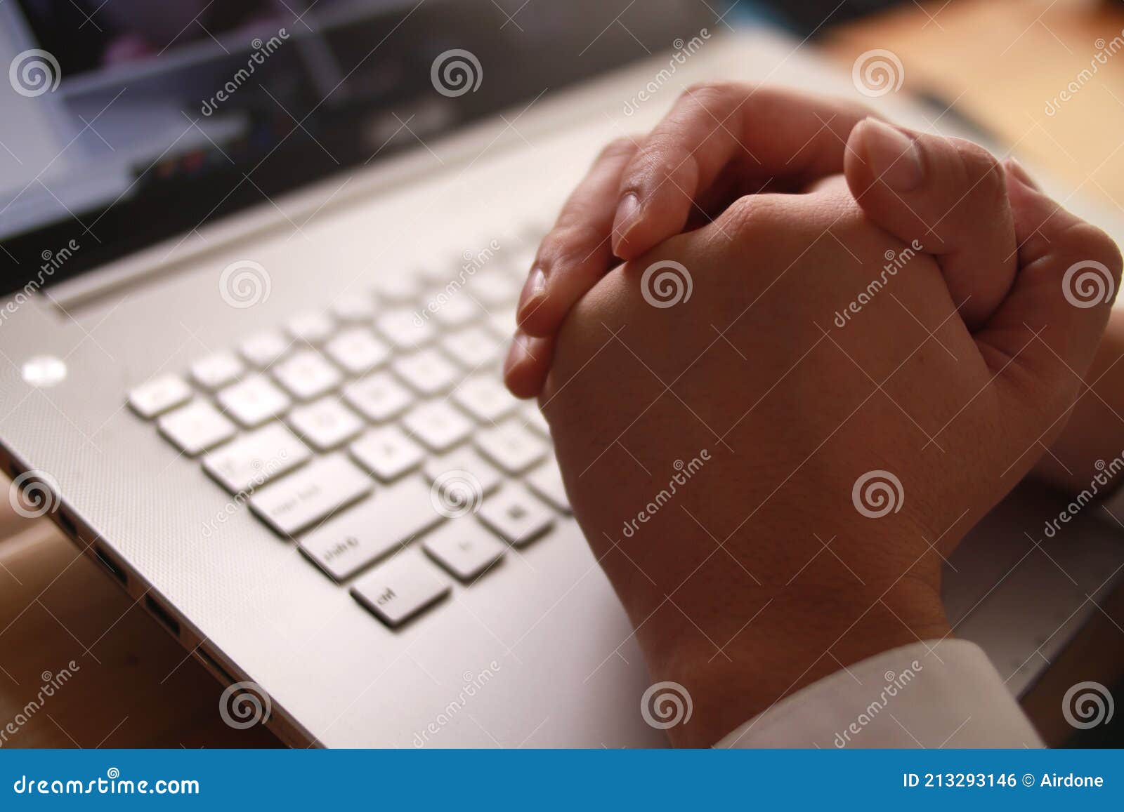 Businessman Hand in Pray Gesture in Front of Laptop Computer Stock ...