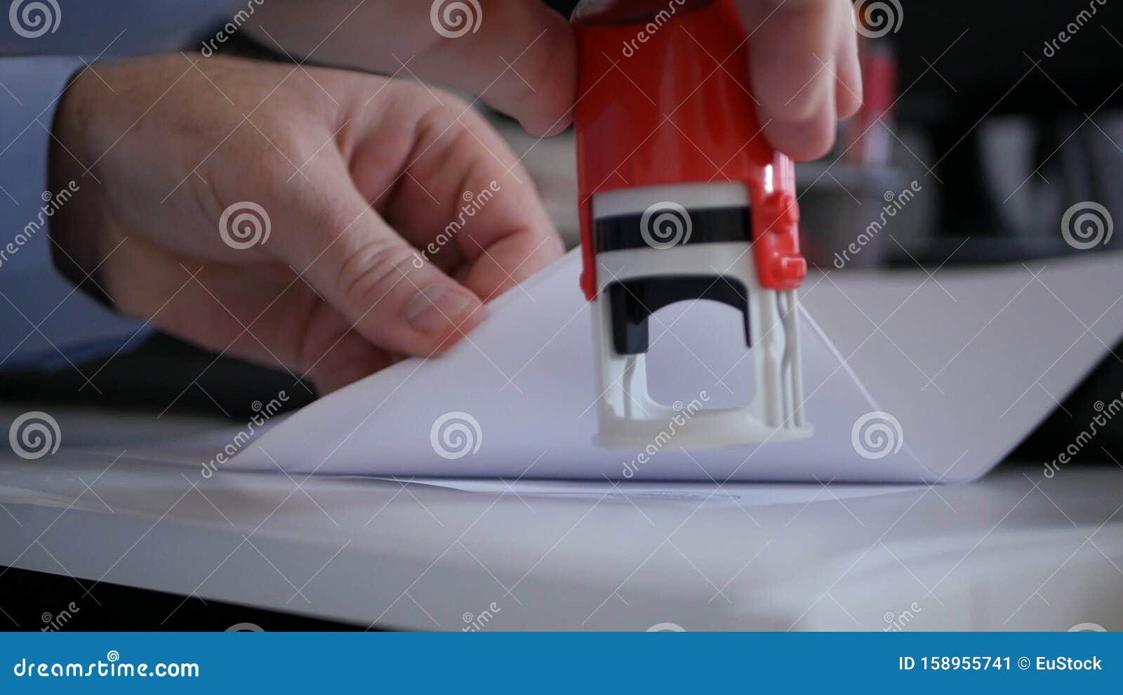 Businessman Hand Stamping Papers and Documents Using a Rubber Stamp ...