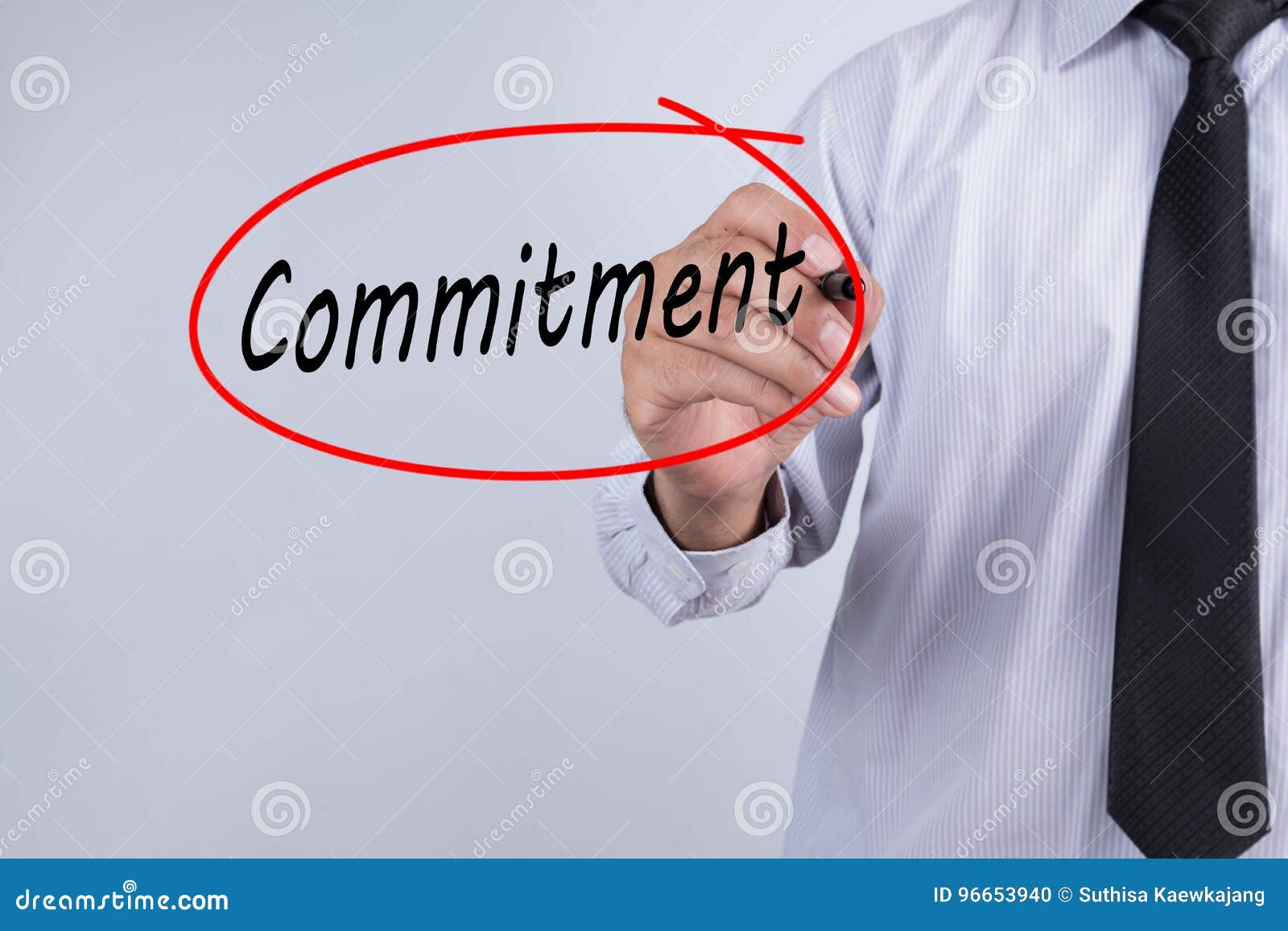 Businessman Hand Writing Commitment with a Marker Over Transparent ...