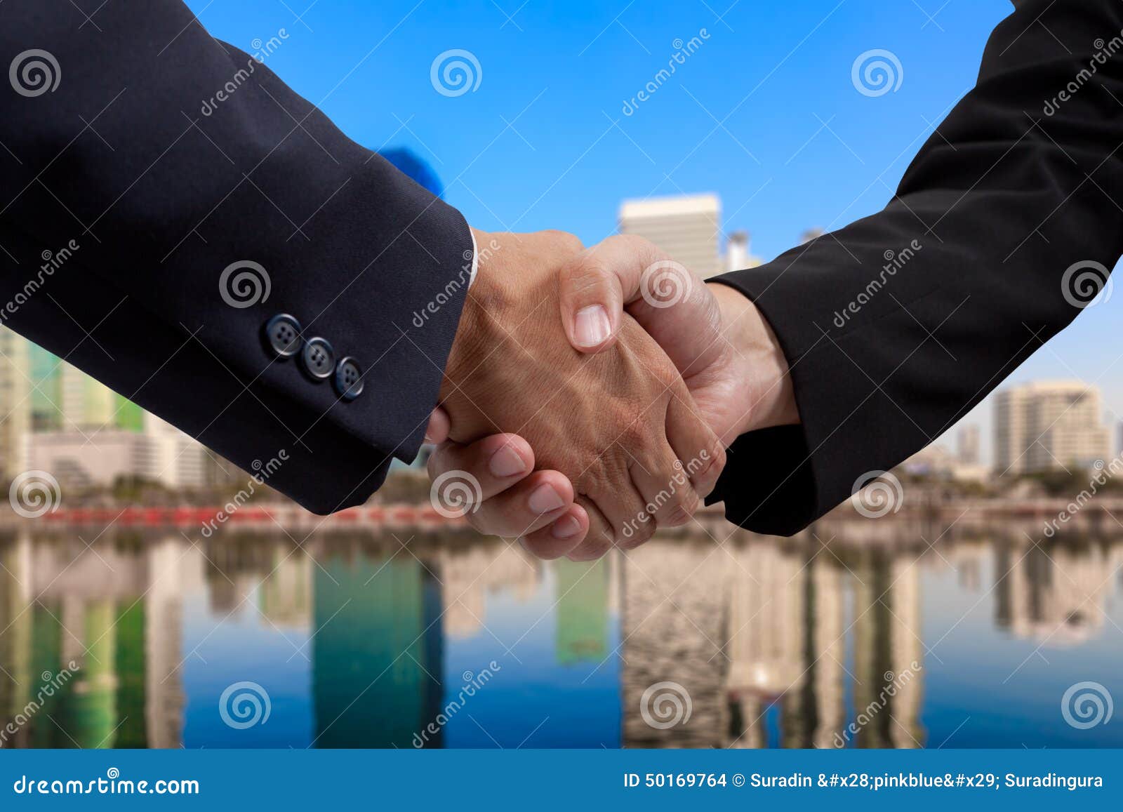 Businessman Handshake with Building Background Stock Photo - Image of ...