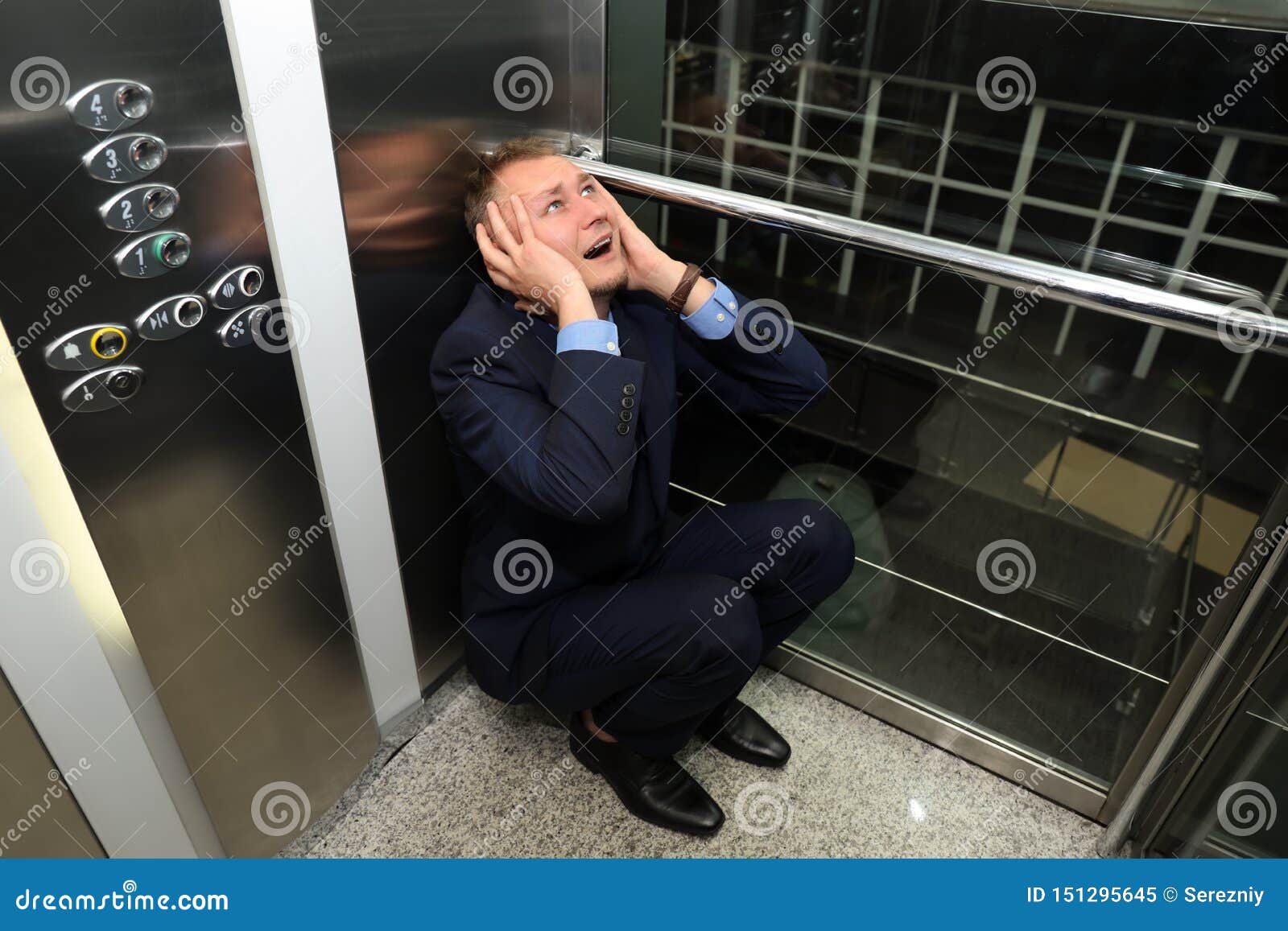 Businessman Having Panic Attack in Elevator Stock Image - Image of ...