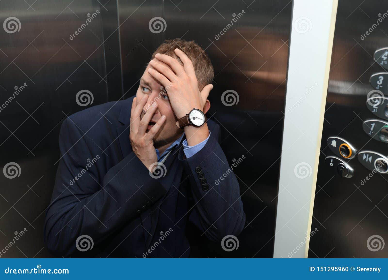 Businessman Having Panic Attack in Elevator Stock Photo - Image of ...