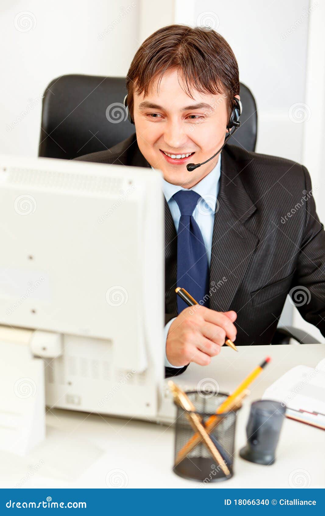 Businessman with Headset Sitting at Office Desk Stock Photo - Image of ...