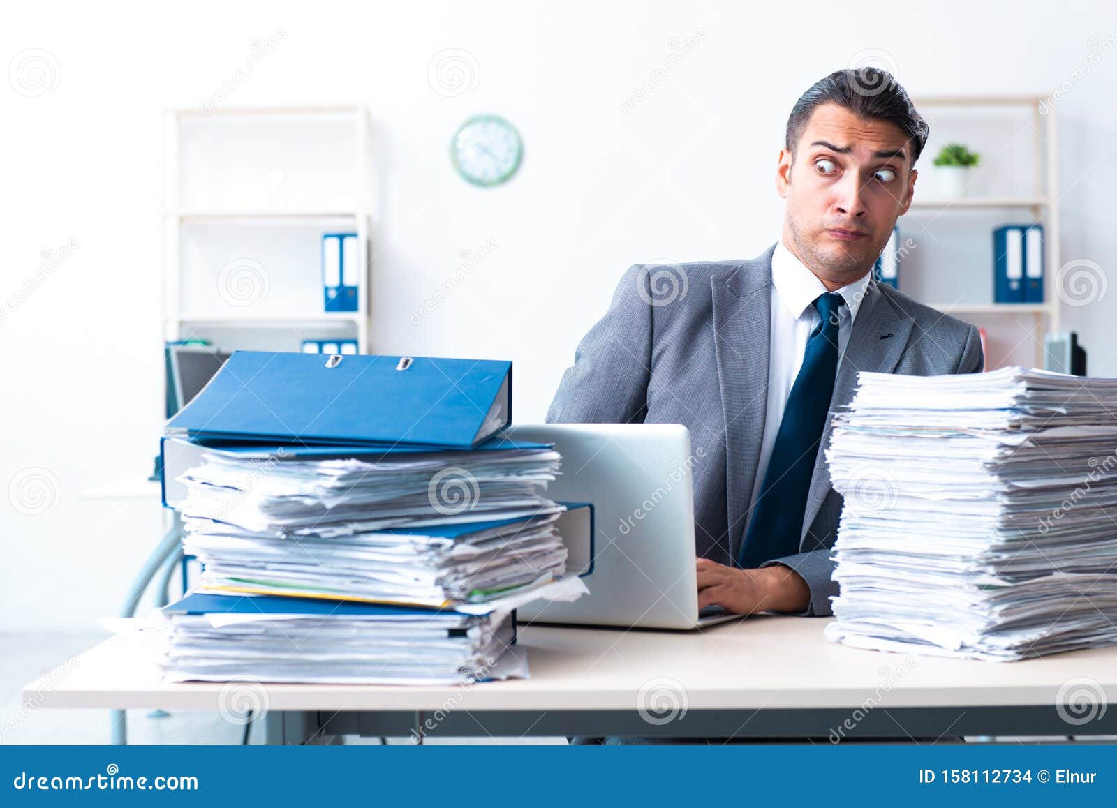 Businessman with Heavy Paperwork Workload Stock Photo - Image of ...