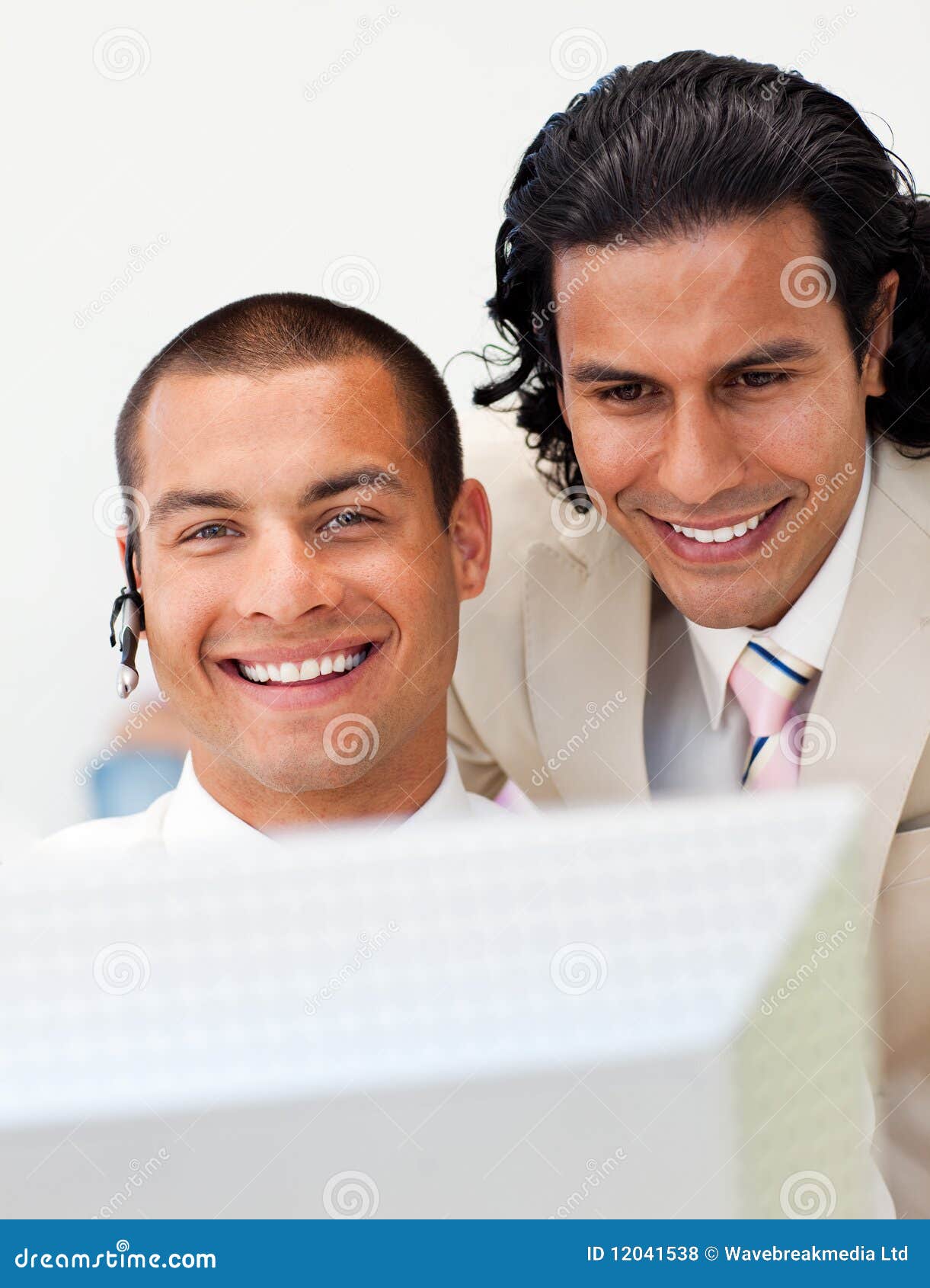 Businessman Helping His Colleague at a Computer Stock Photo - Image of ...