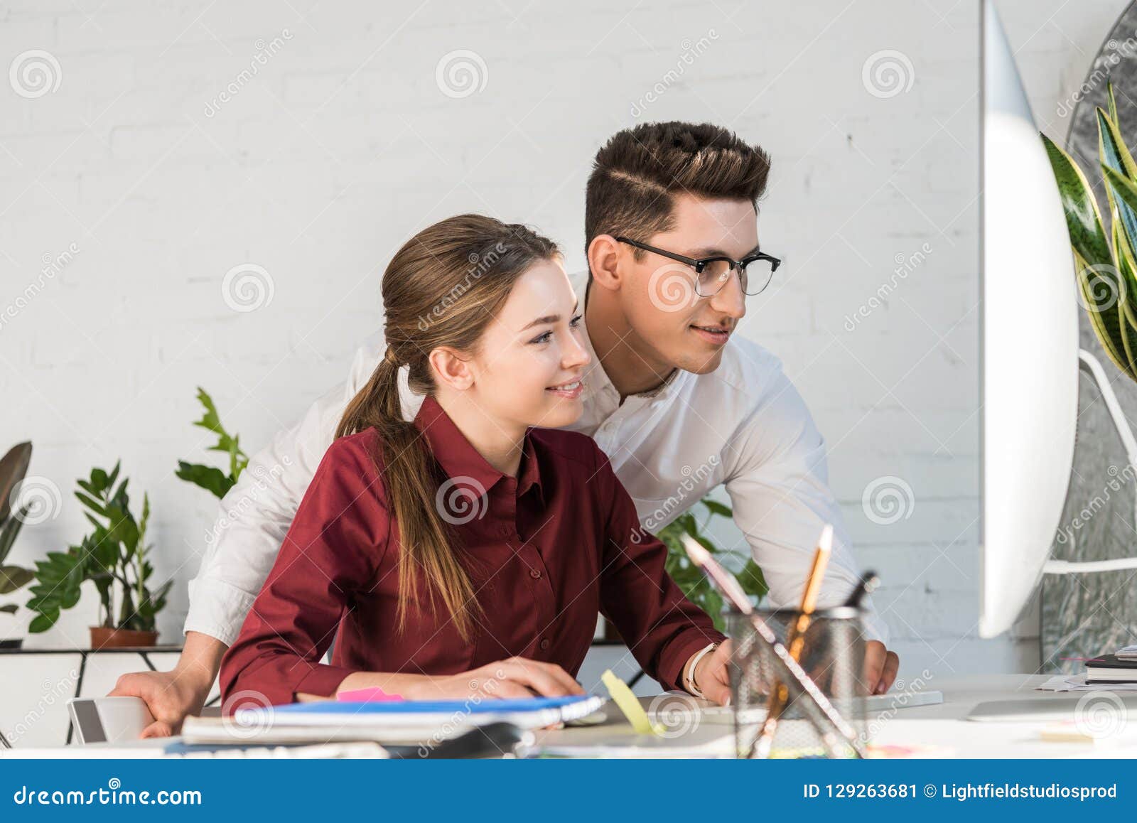 Businessman Helping His Colleague with Computer Work and Embracin Her ...
