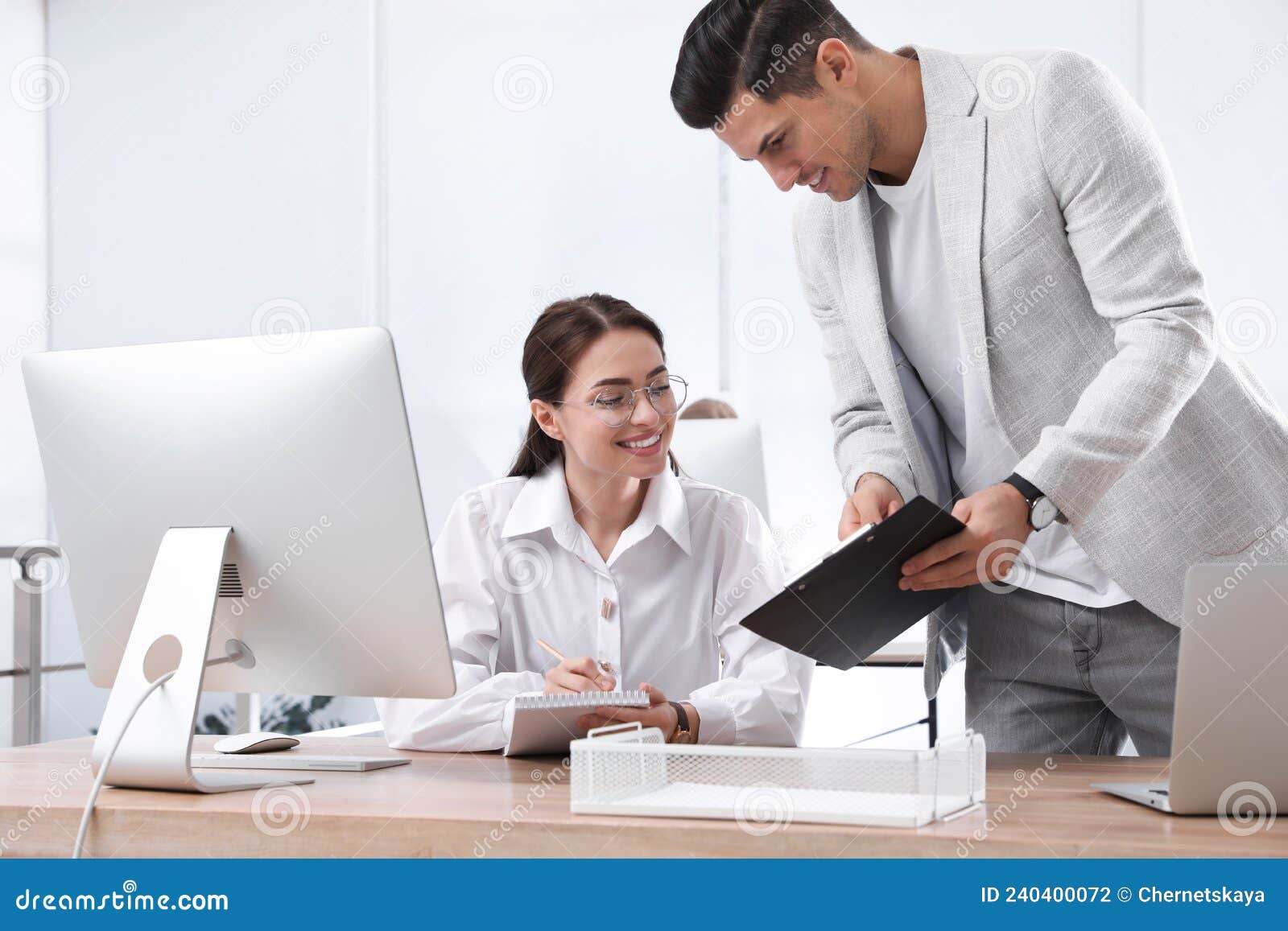Businessman Helping Intern with Work in Office Stock Photo - Image of ...