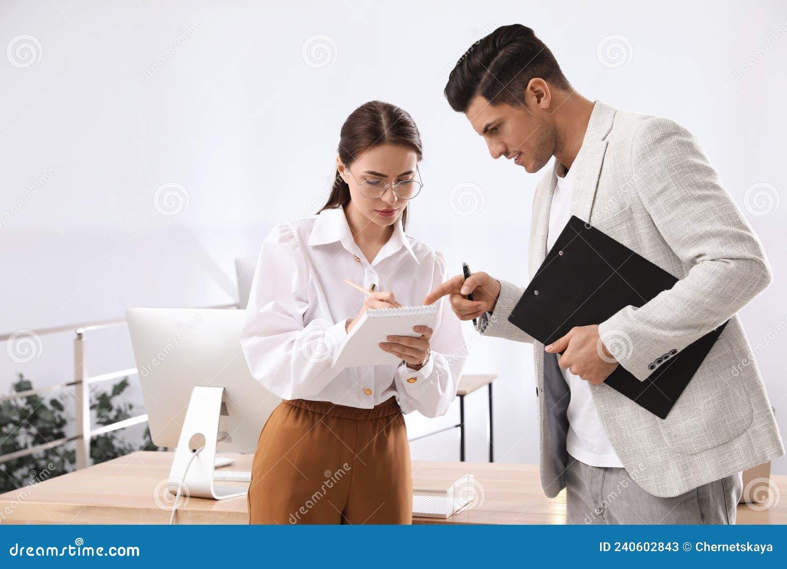 Businessman Helping Intern with Work in Office Stock Image - Image of ...