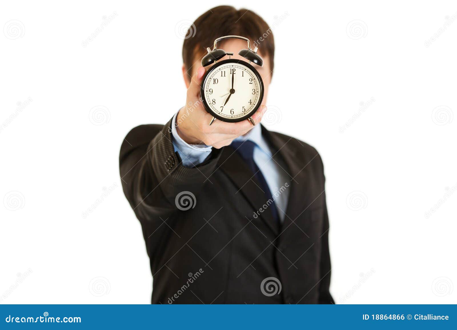 Businessman Holding Alarm Clock in Front of Face Stock Photo - Image of ...