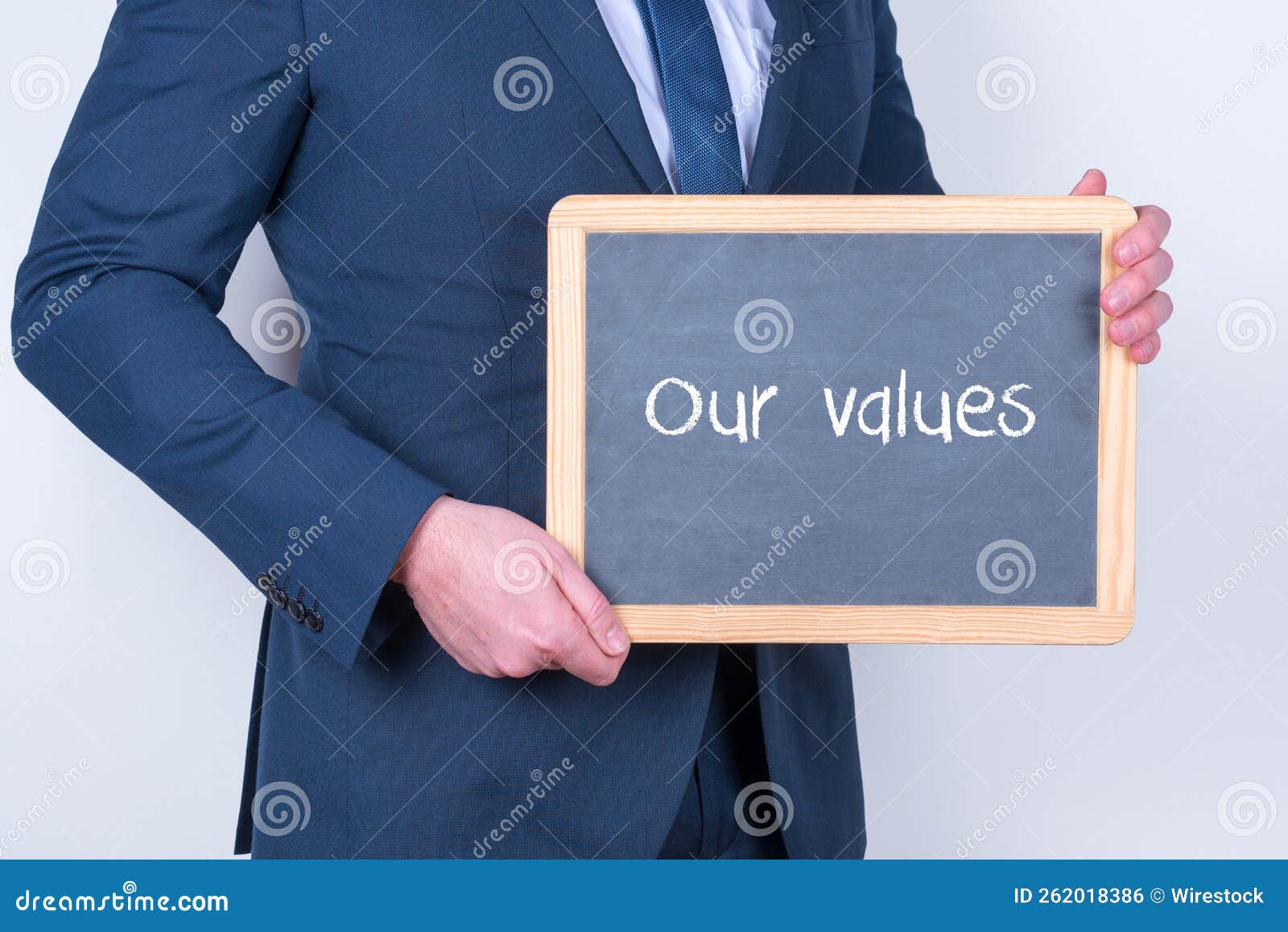 Businessman Holding a Blackboard with Our Values Text Stock Photo ...