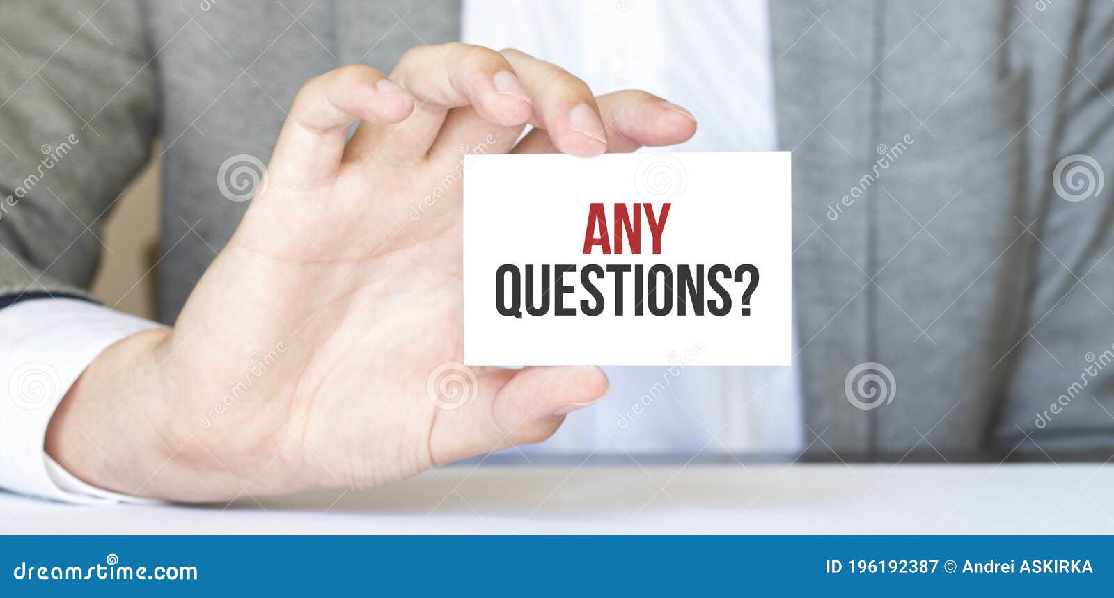 Businessman Holding a Card with Text ANY QUESTIONS Stock Image - Image ...