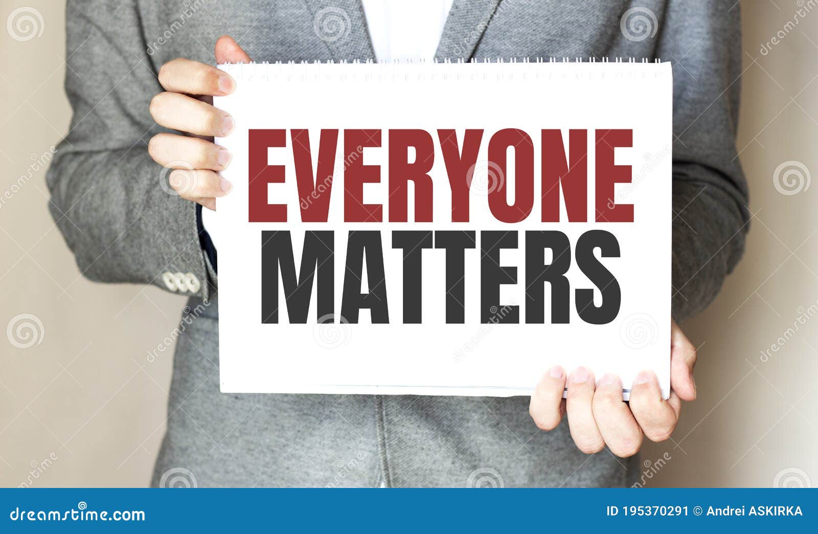 Businessman Holding a Card with Text EVERYONE MATTERS Stock Image ...