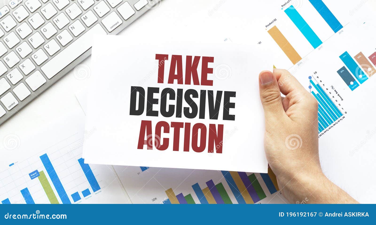 Businessman Holding a Card with Text TAKE DECISIVE ACTION. Keyboard ...
