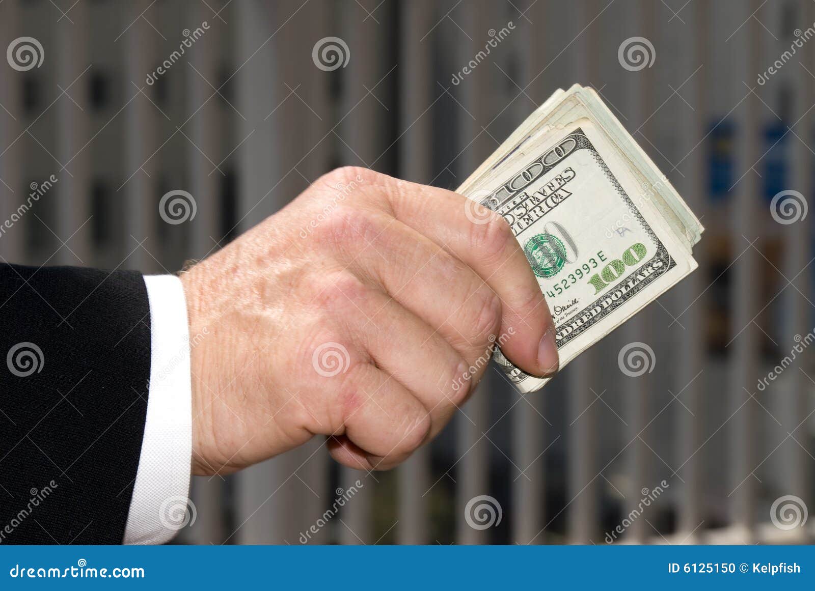 Businessman holding cash stock photo. Image of currency - 6125150