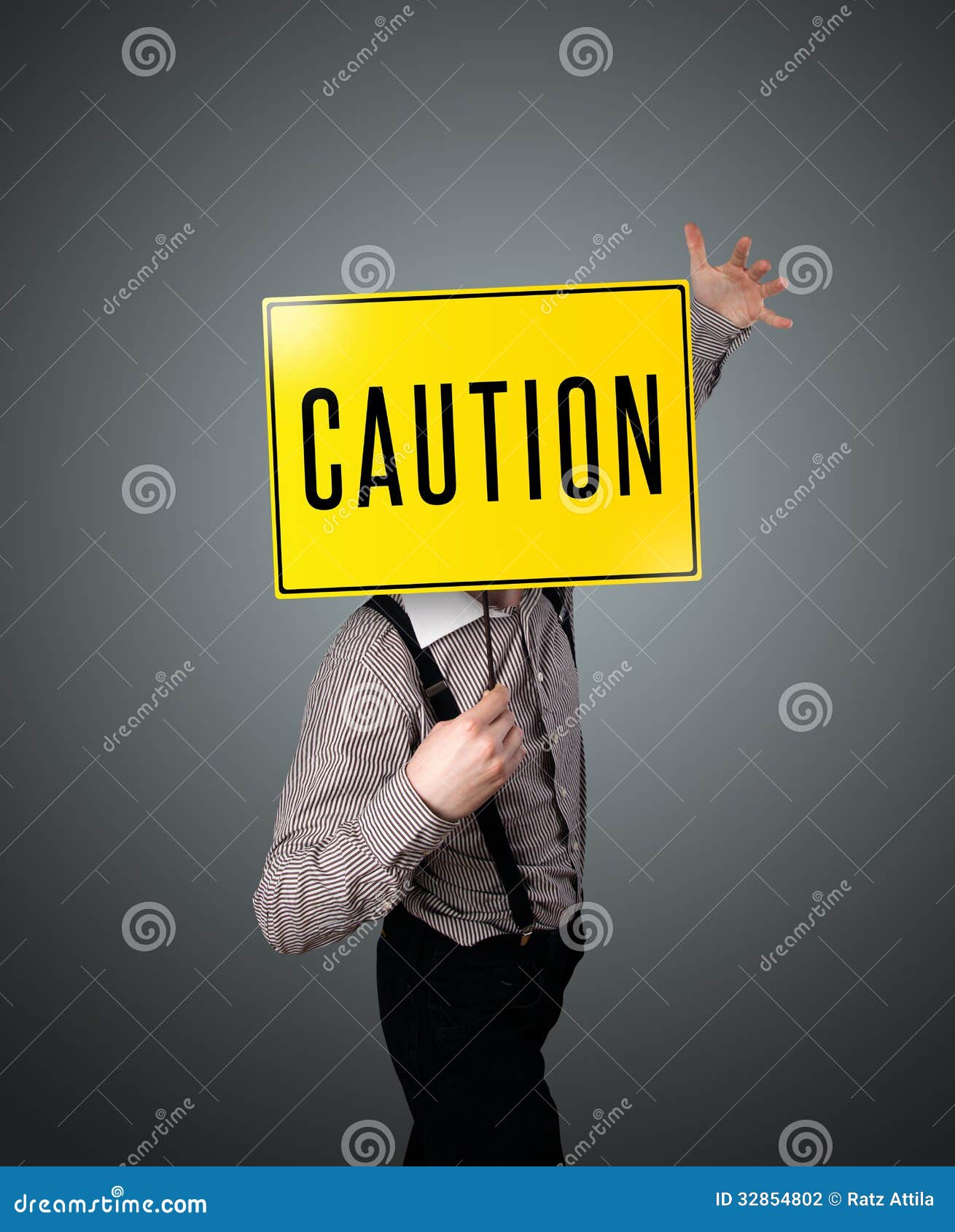 Businessman Holding a Caution Sign Stock Photo - Image of concept ...