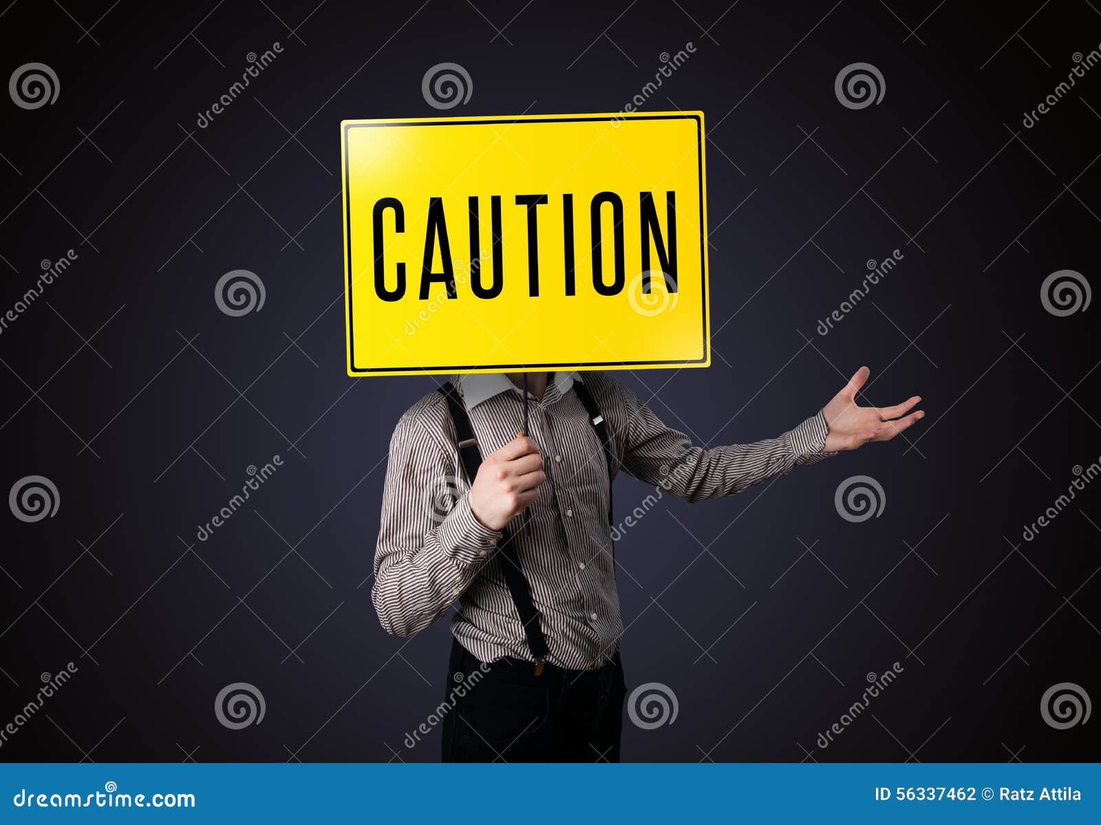 Businessman Holding a Caution Sign Stock Photo - Image of hold, casual ...