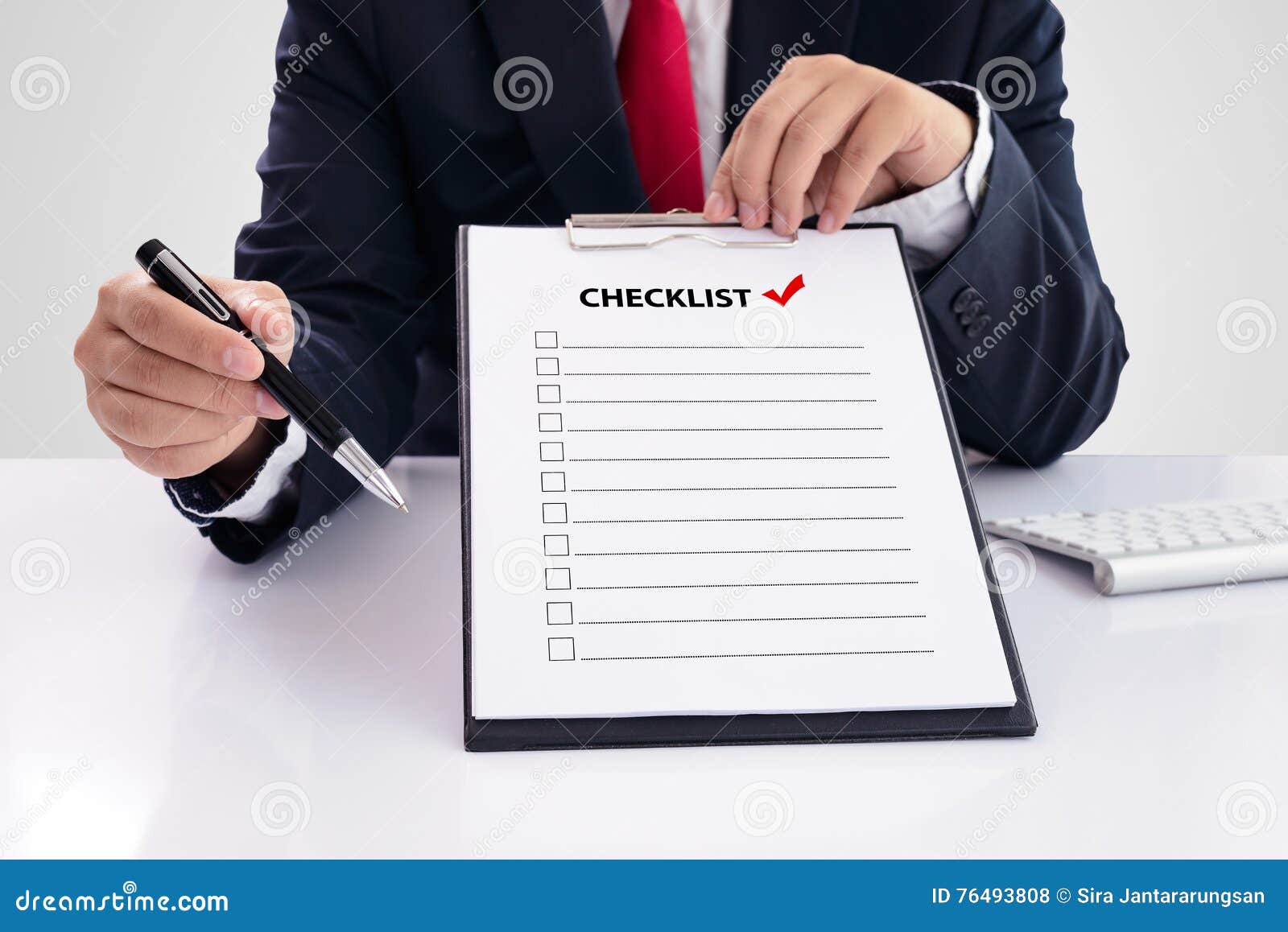 Businessman Holding Clipboard with Checklist Against Stock Photo ...
