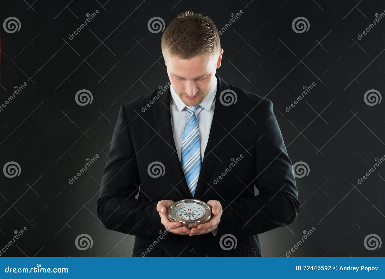 Businessman Holding Compass Stock Photo - Image of direction ...