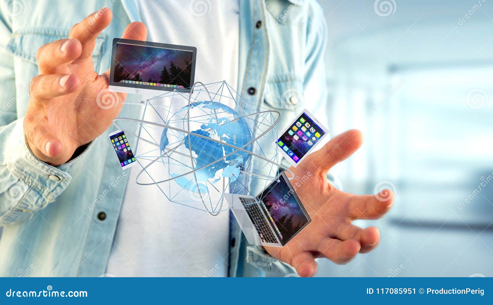 Businessman Holding a Computer and Devices Displayed on a Futuristic ...