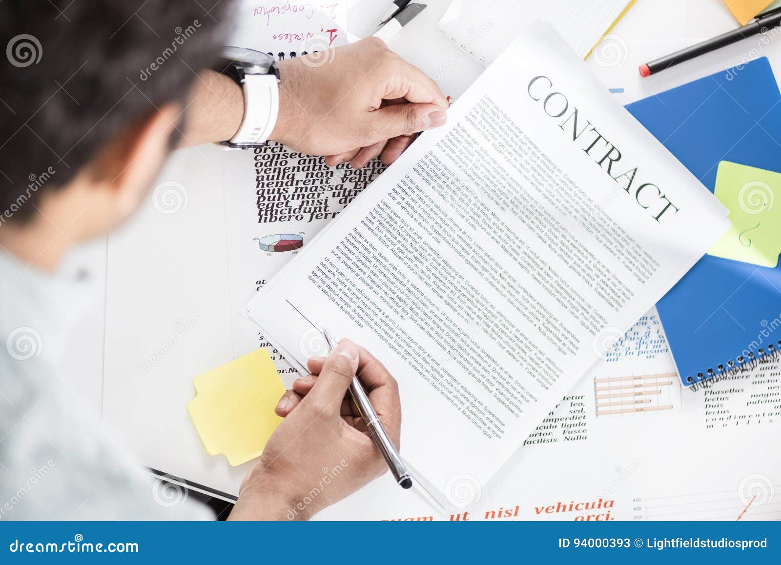 Businessman Holding Contract Above Table with Papers Stock Image ...