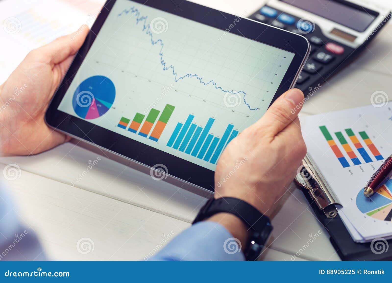 Businessman Holding Digital Tablet with Graphs and Charts Report Stock ...