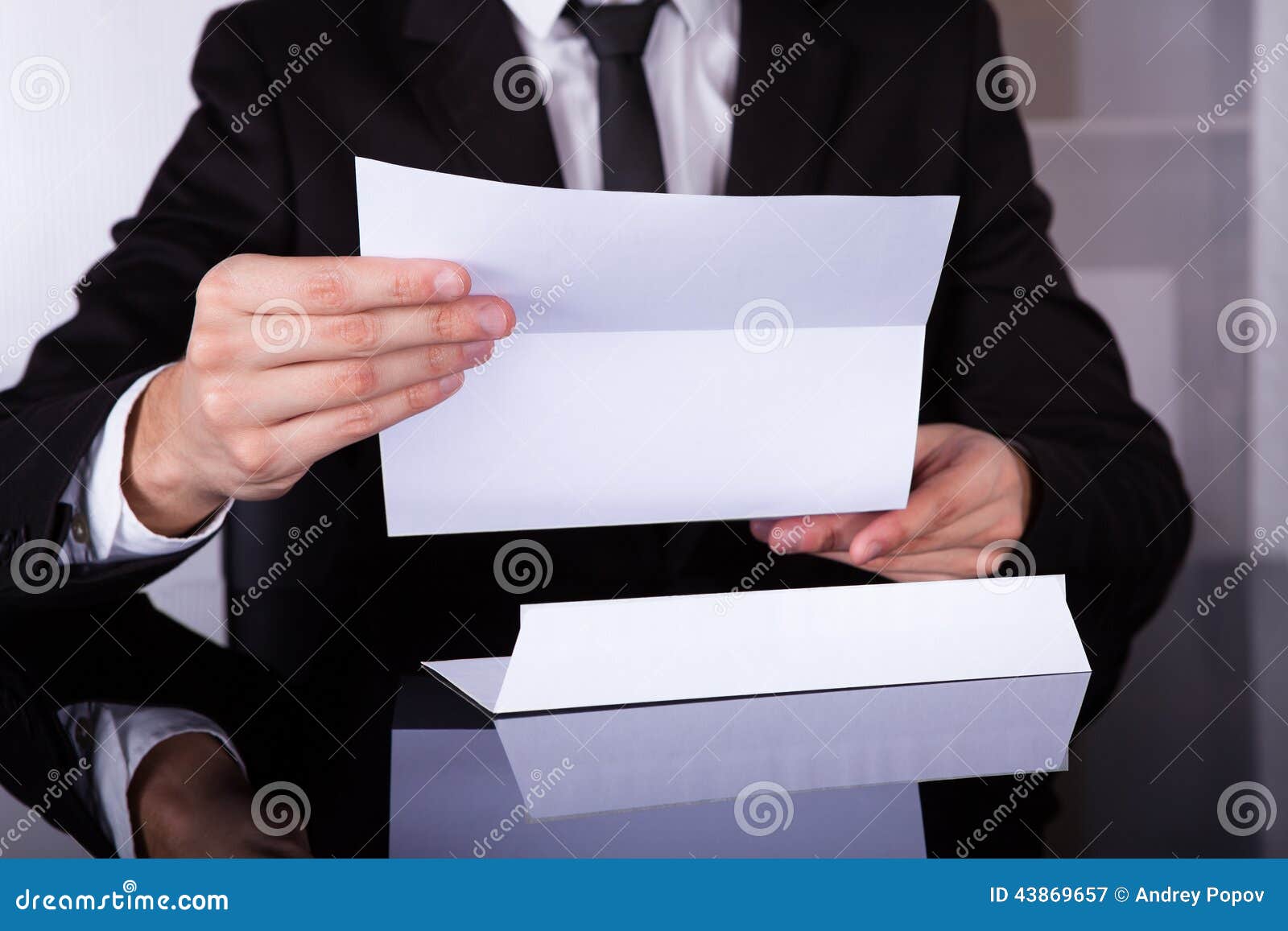 Businessman Holding Document at Desk Stock Image - Image of indoors ...